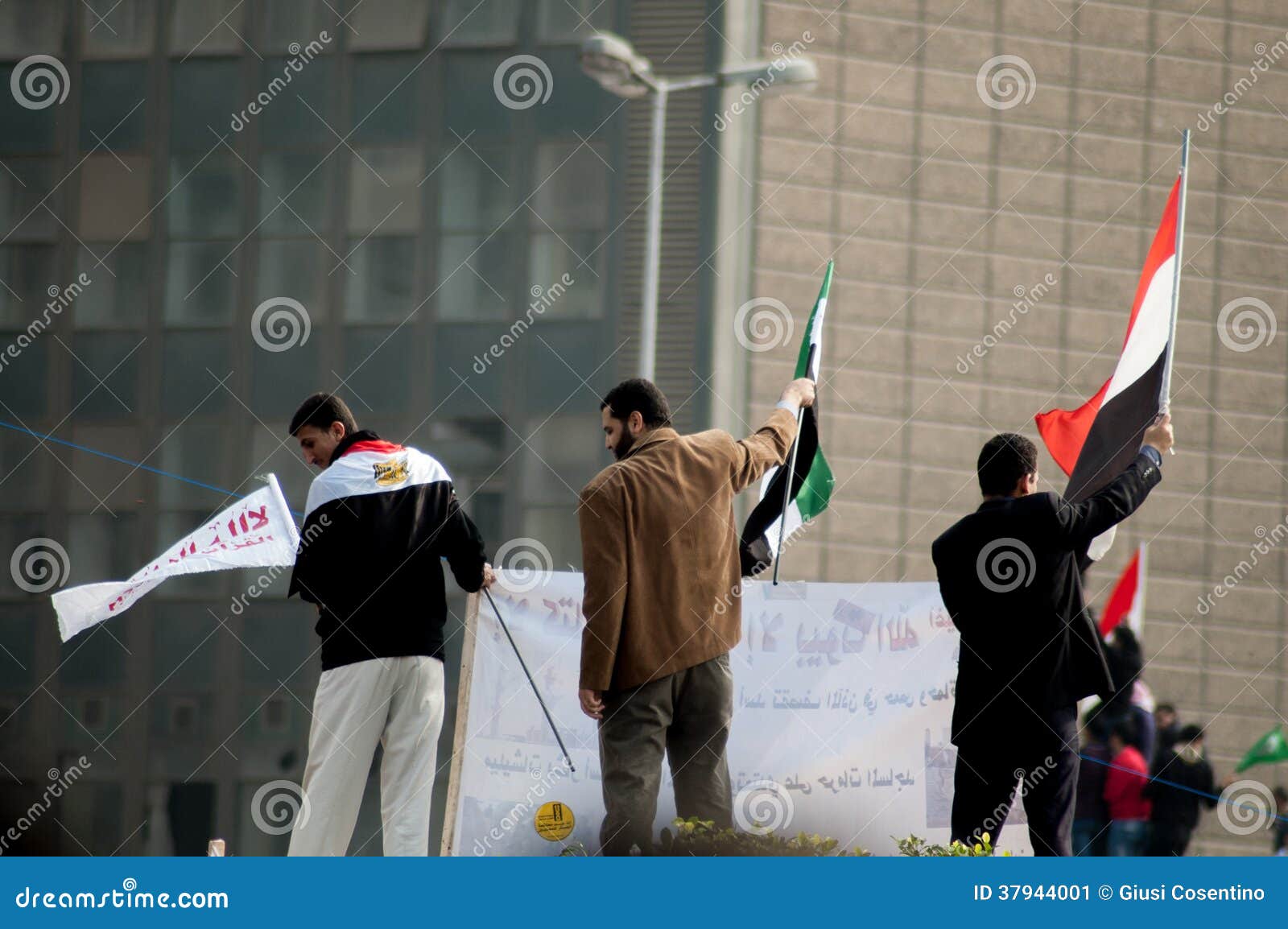 Men in the Arab revolution editorial photo. Image of spring - 37944001