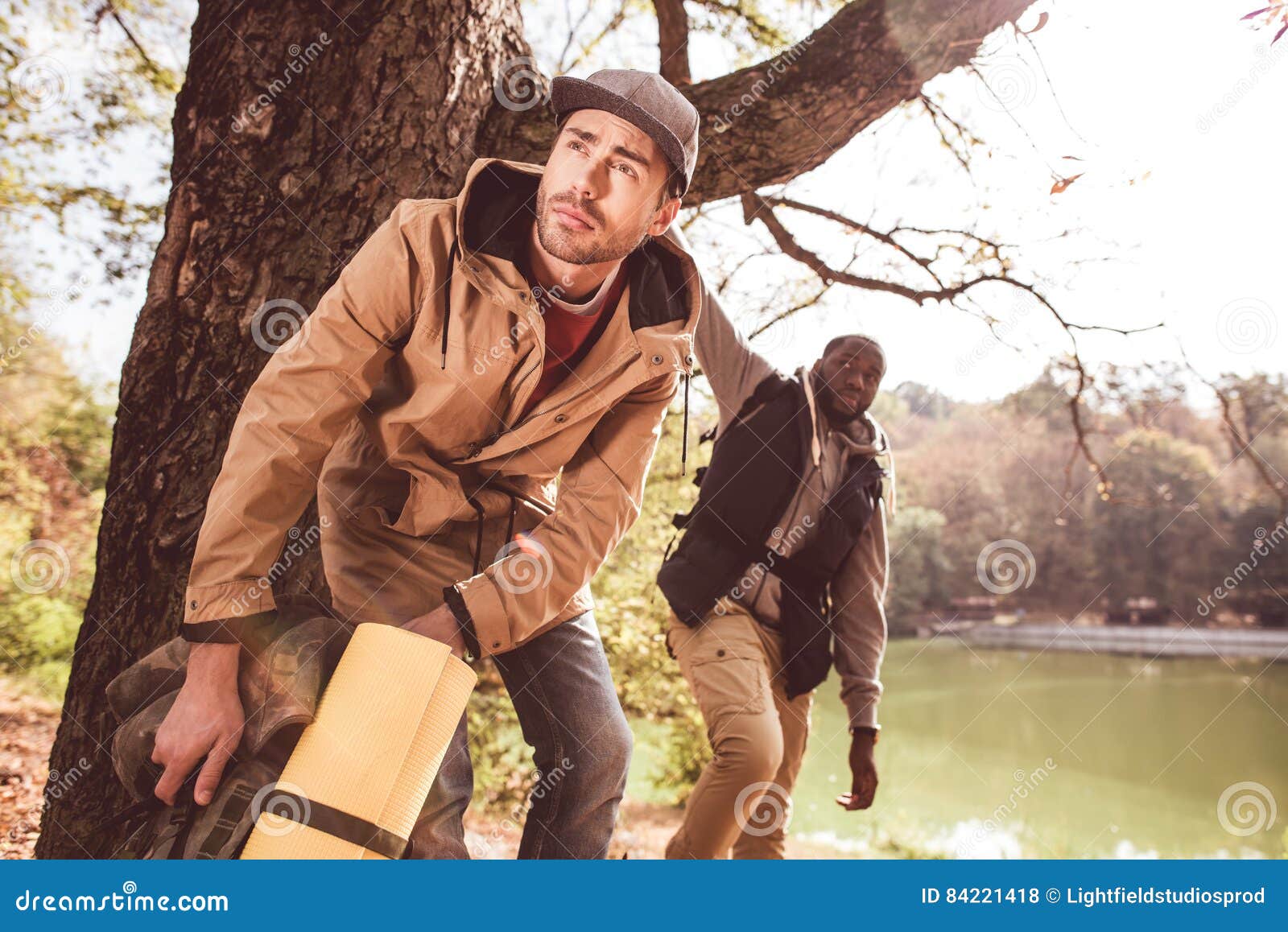 Men Backpackers Standing Near River Stock Photo - Image of travelling ...