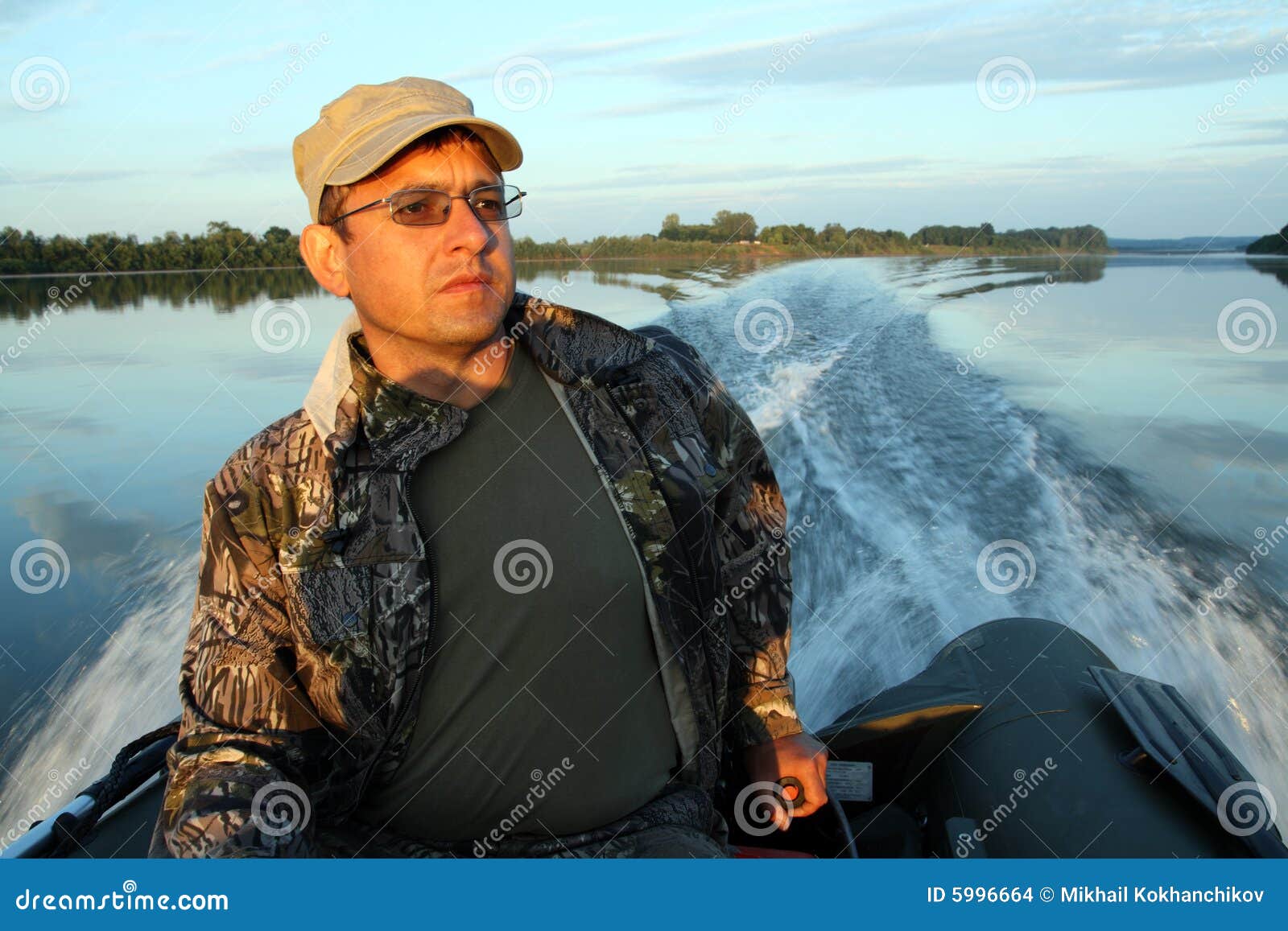 Men on boat with motor stock photo. Image of inflatable - 5996664