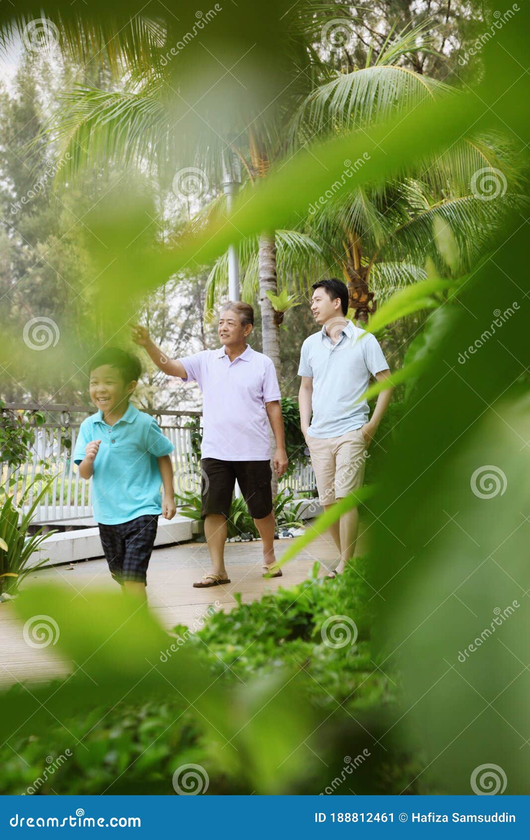 Men and Boy Taking a Stroll Down the Promenade. Conceptual Image Stock ...