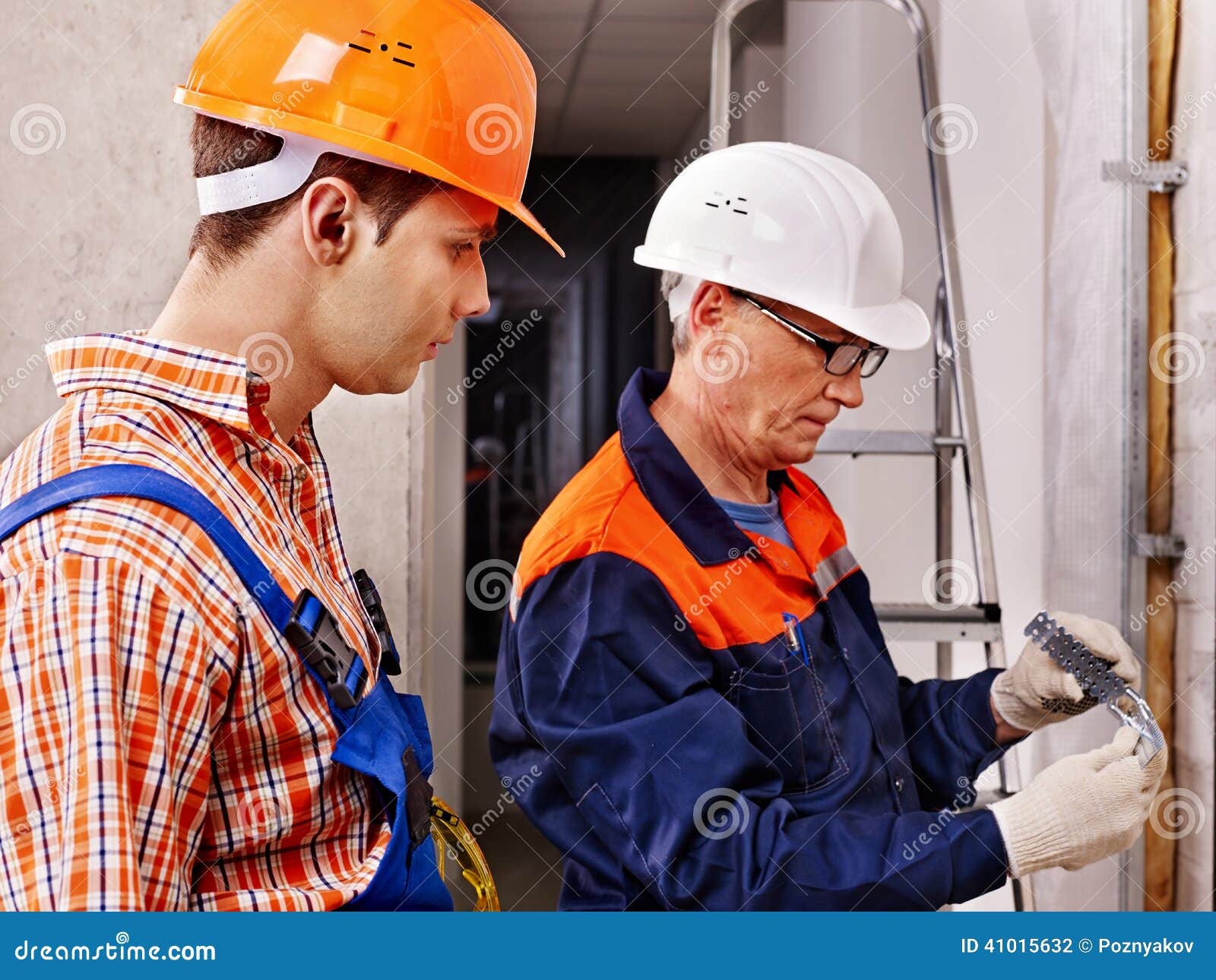 Men in builder uniform. stock photo. Image of construction - 41015632