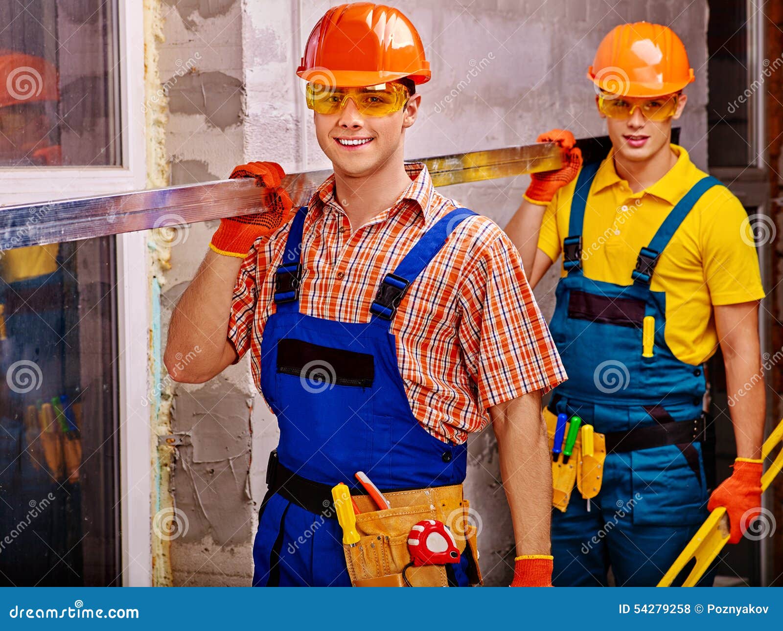 Men in builder uniform stock photo. Image of building - 54279258
