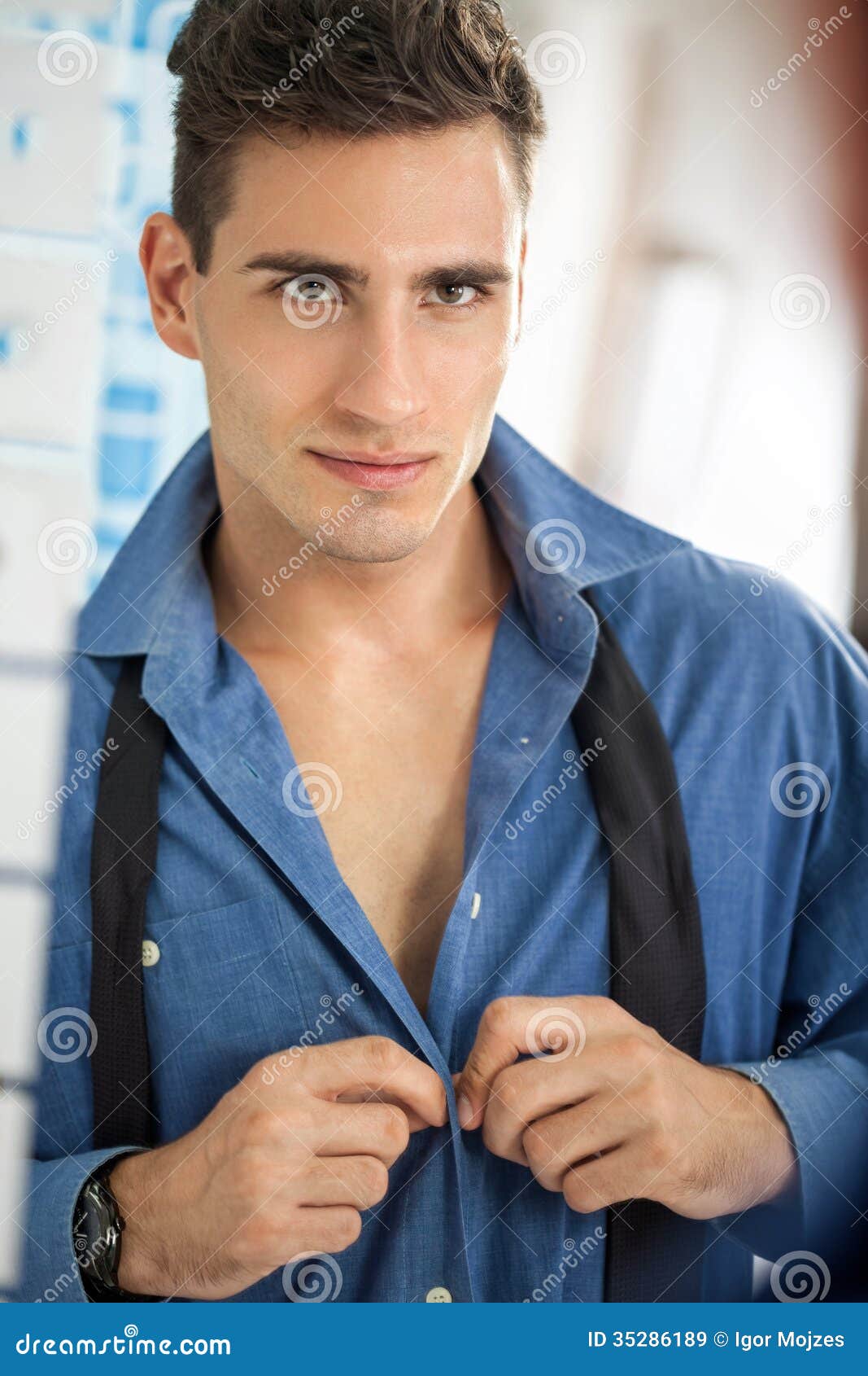 Men buttoning his shirt stock image. Image of beauty - 35286189