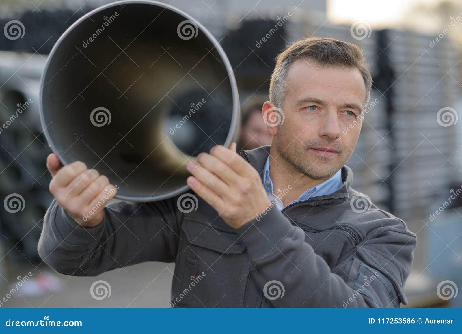 Men carrying the tube stock photo. Image of loading - 117253586