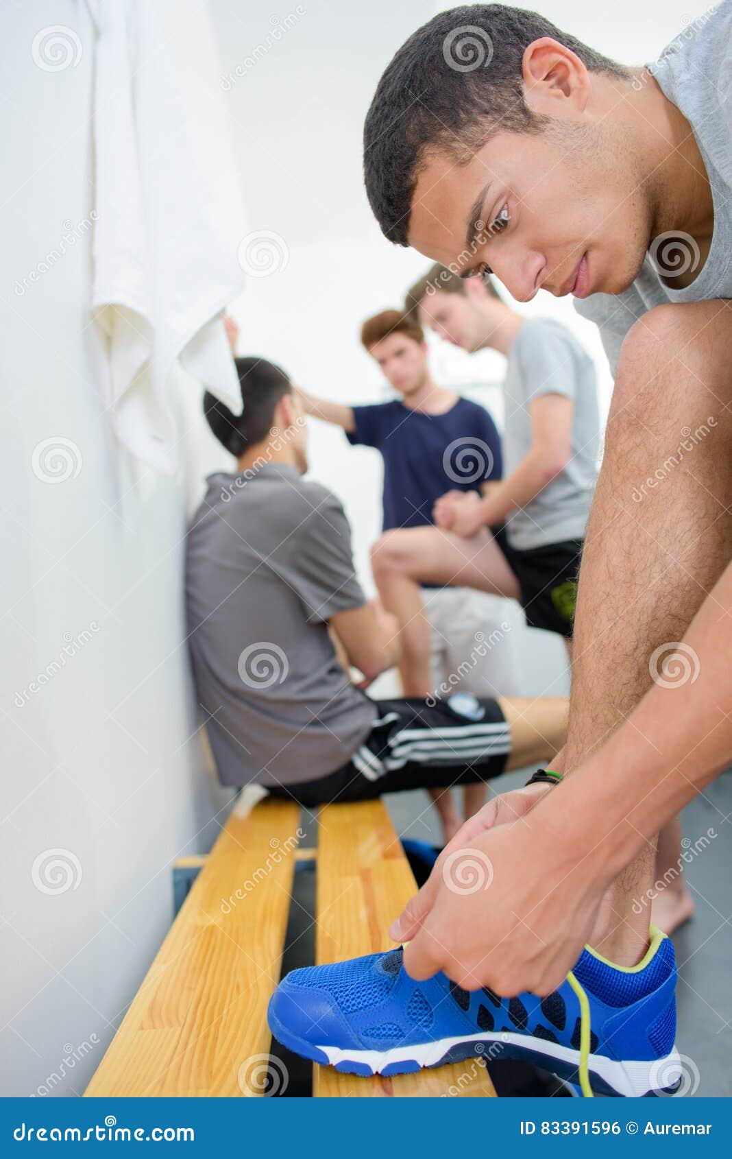 Men in changing room stock photo. Image of break, laces - 83391596