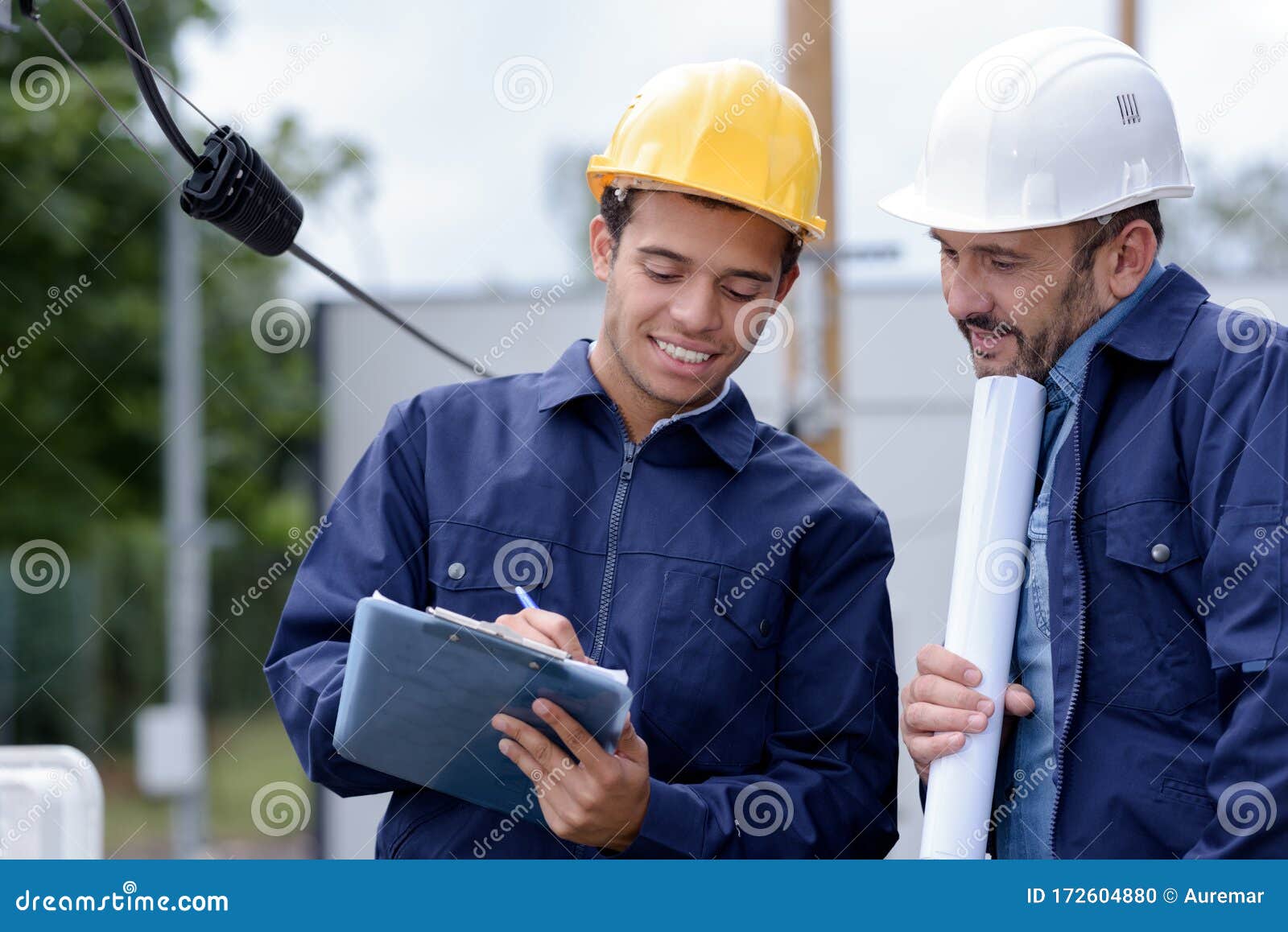 Men Checking Clipboard Outdoors Stock Photo - Image of building, site ...