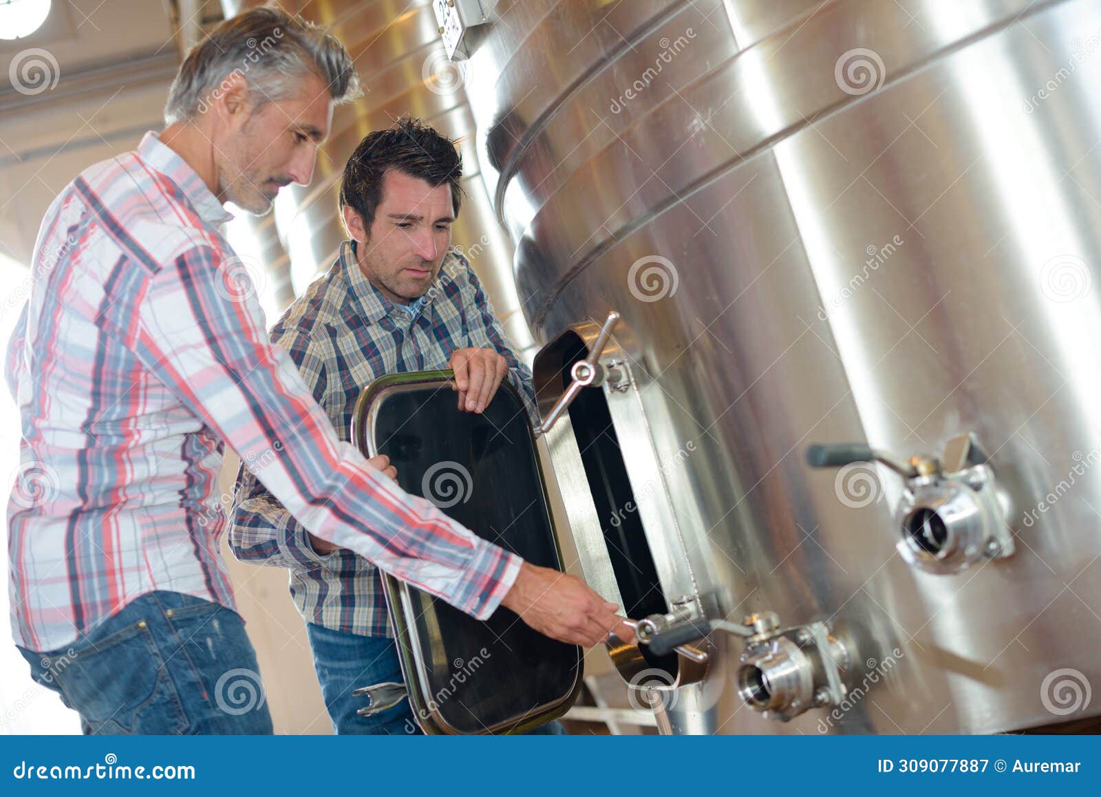 Men cleaning vat stock image. Image of temperature, control - 309077887