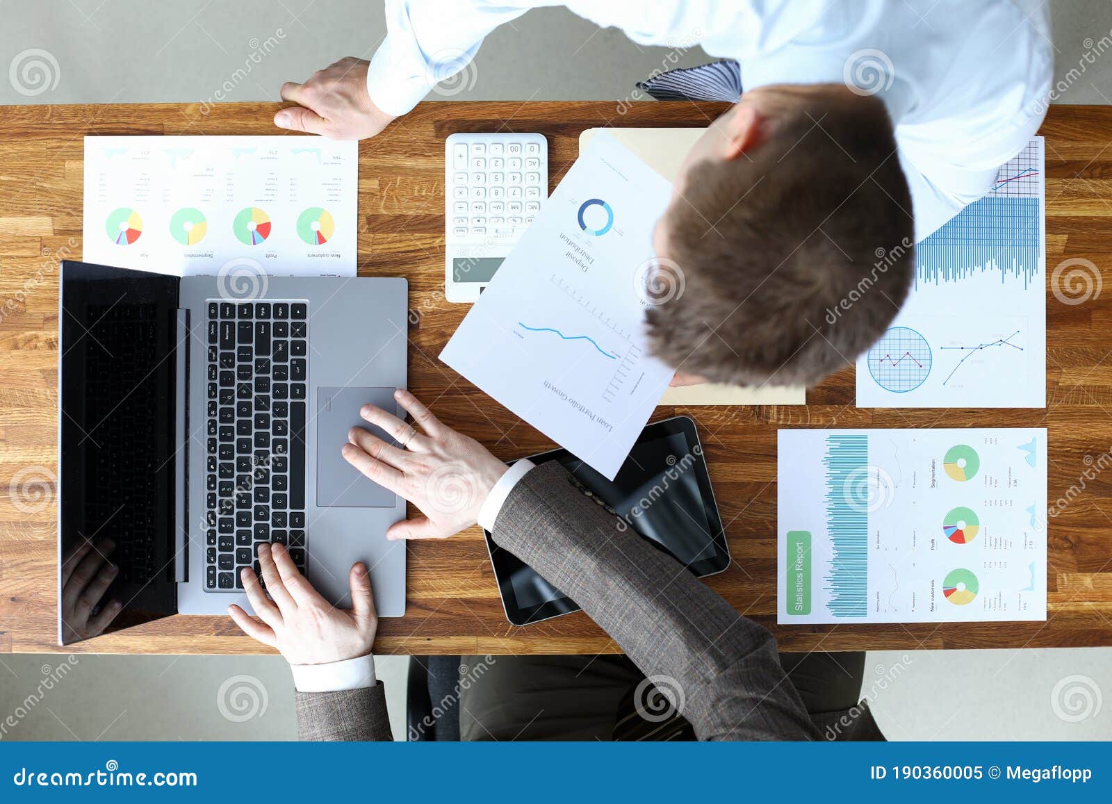 Men Coordinate Work on Documents Electronically Stock Image - Image of ...