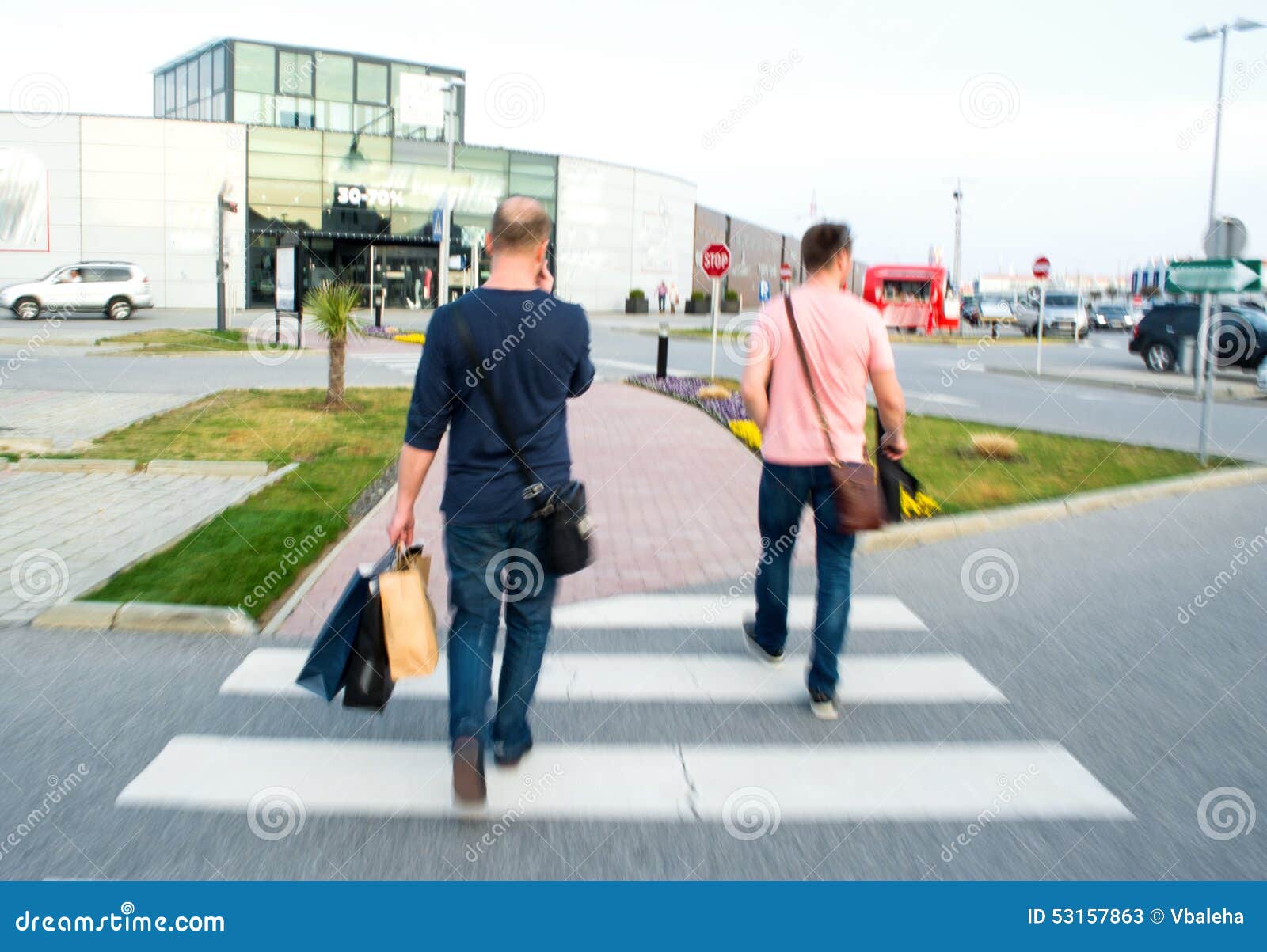 Men crossing the street stock image. Image of downtown - 53157863