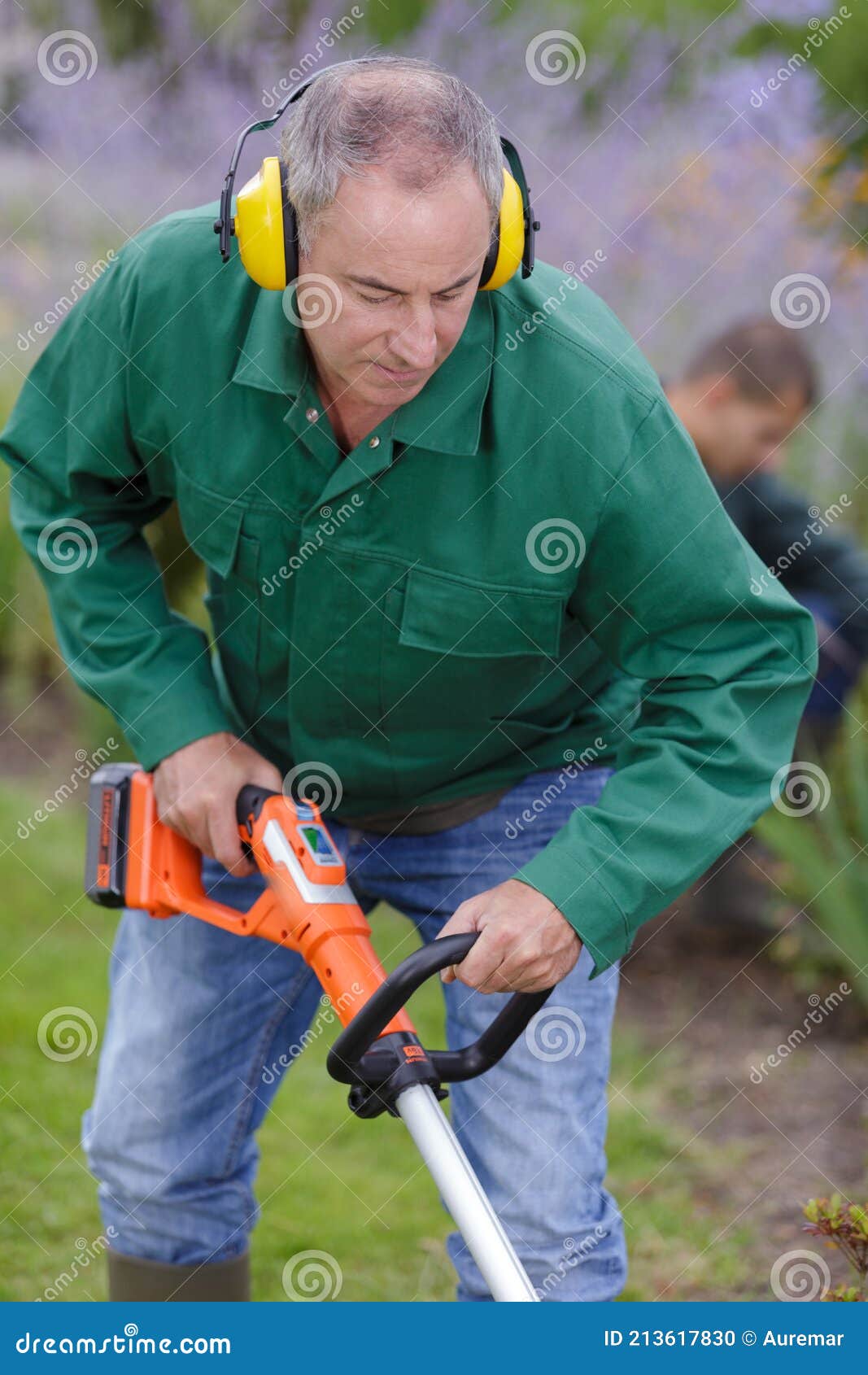 Men cuts grass cut grass stock photo. Image of ground - 213617830