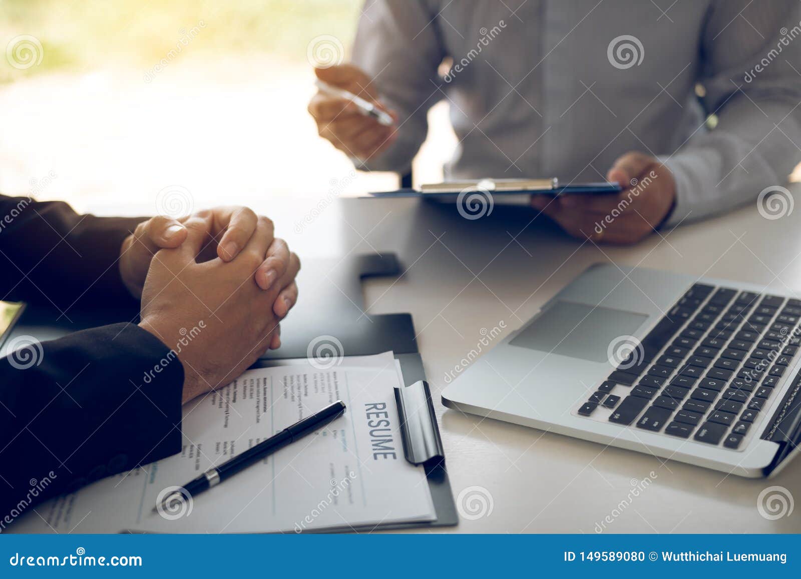 Men are Describing the Employment History of the Employer about His ...