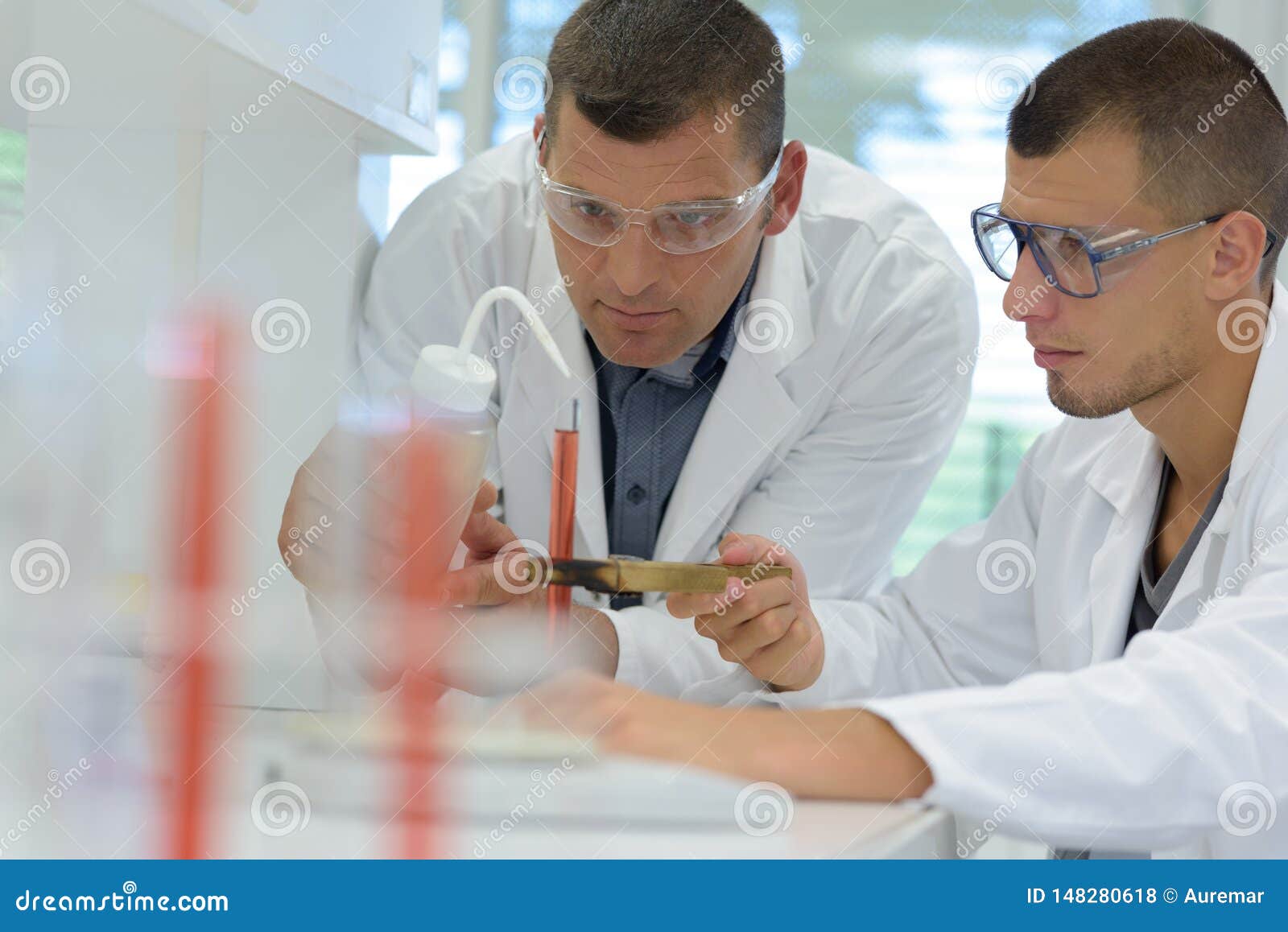 Men Doing Laboratory Expirement Stock Photo - Image of scientist ...