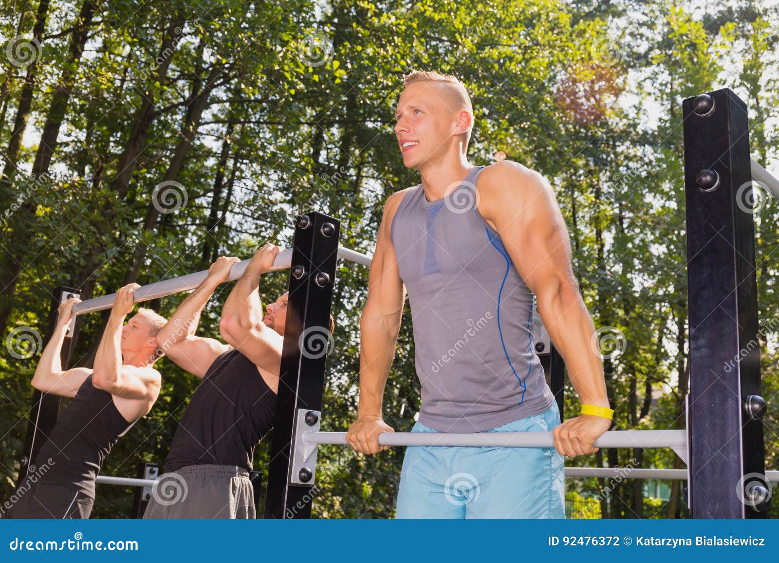 Men doing pull-ups stock photo. Image of activity, sport - 92476372