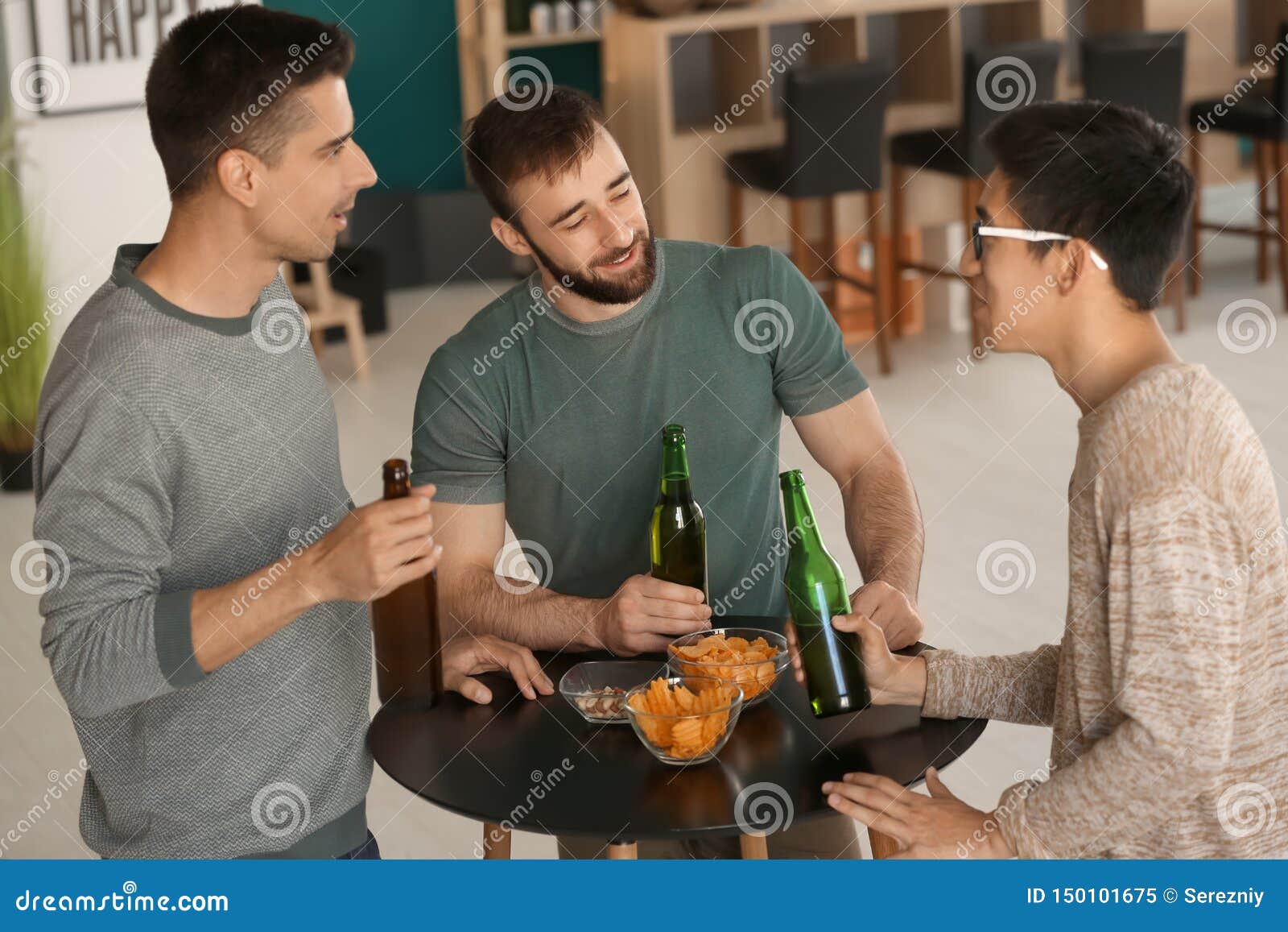 Men drinking beer in bar stock image. Image of pint - 150101675