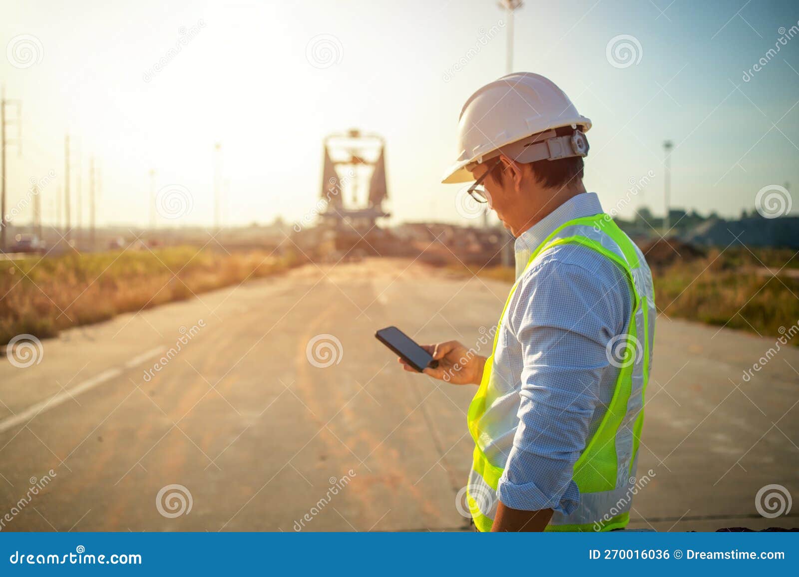 Men Engineer Using Mobile Phone and Holding Tablet for Inspecting and ...