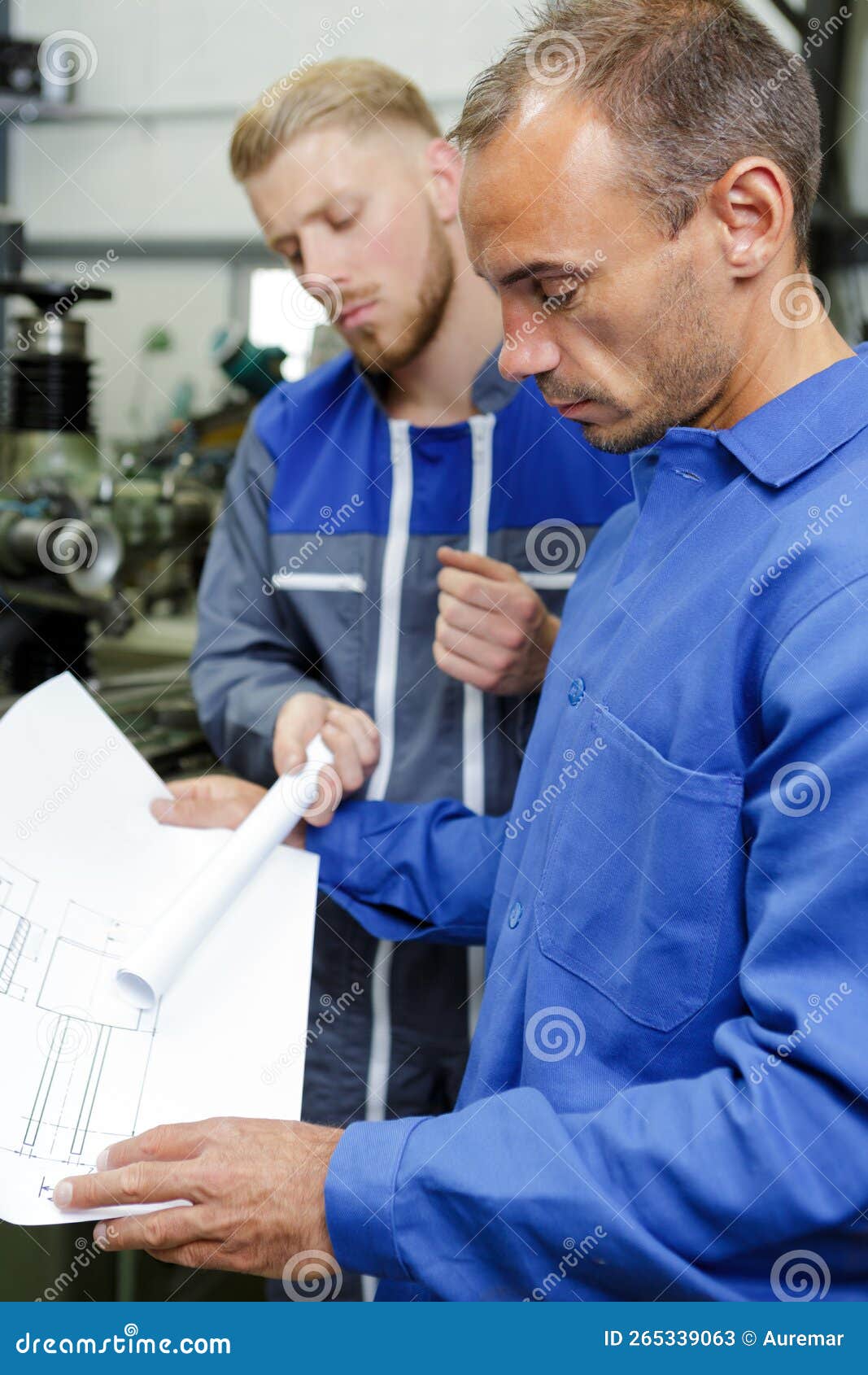 Men in Factory Looking at Paperwork Stock Image - Image of partnership ...