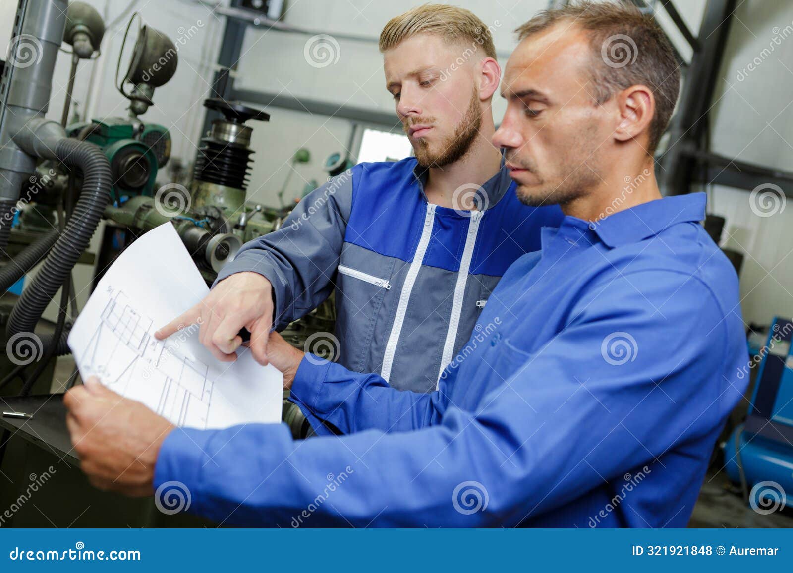 Men in Factory Looking at Paperwork Stock Photo - Image of senior ...