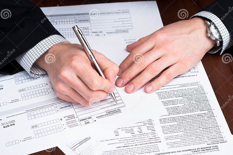 Men Filling Out Documents on a Desk. Stock Image - Image of office ...