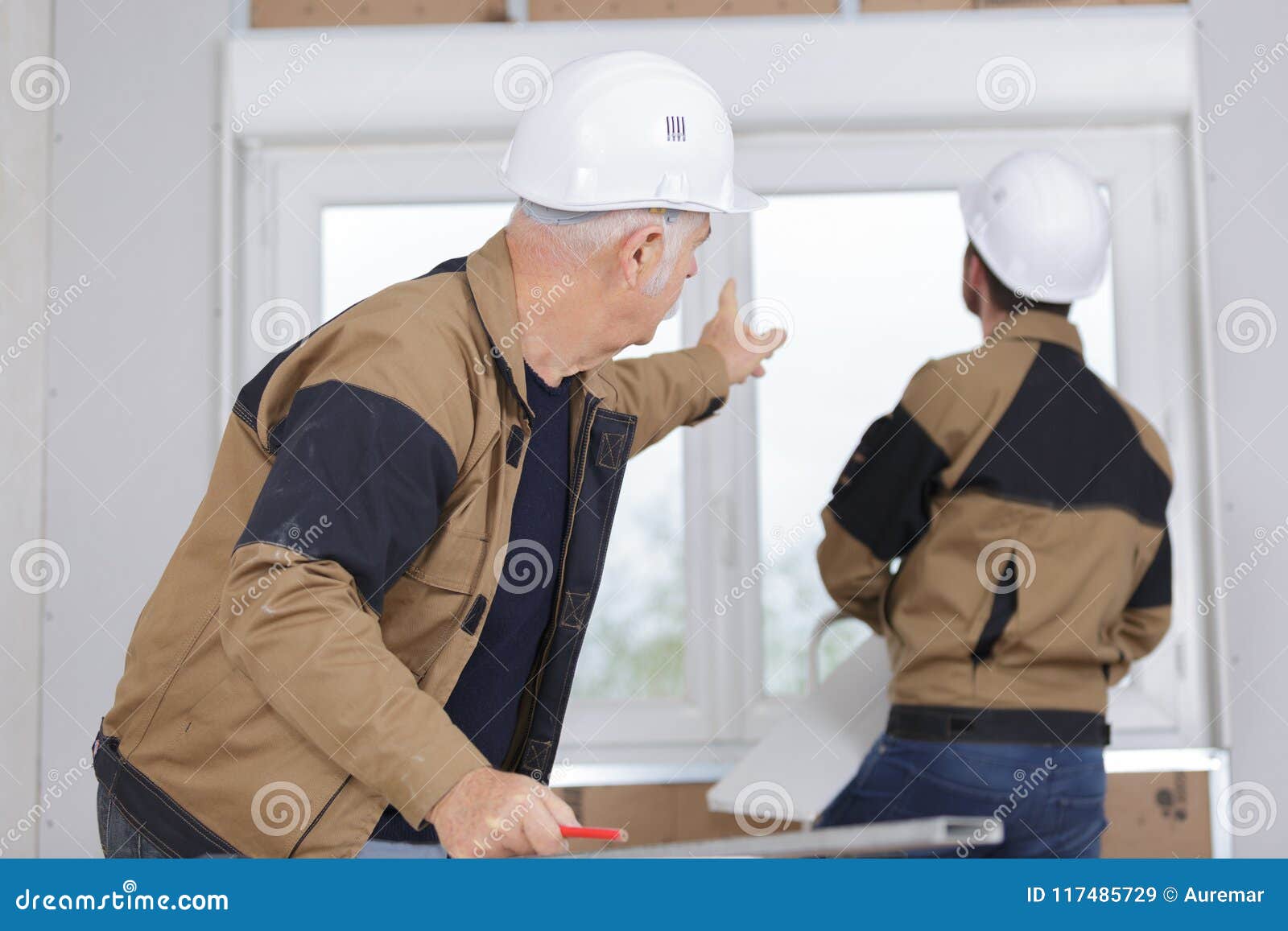 Men fitting new pvc window stock image. Image of light - 117485729