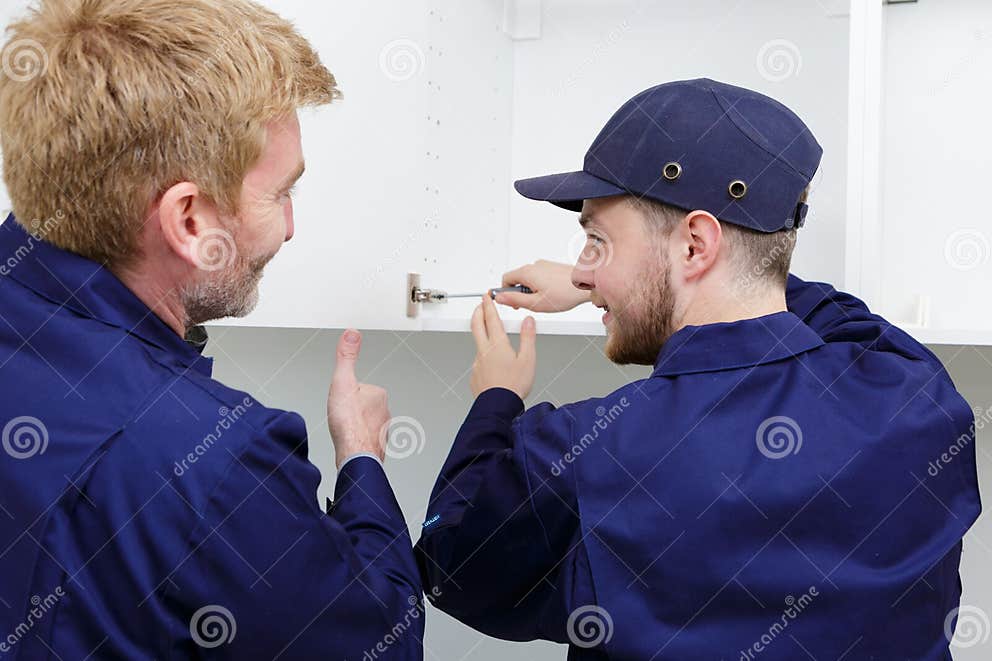 Men Fixing and Installing Fitted Cupboard Stock Photo - Image of ...