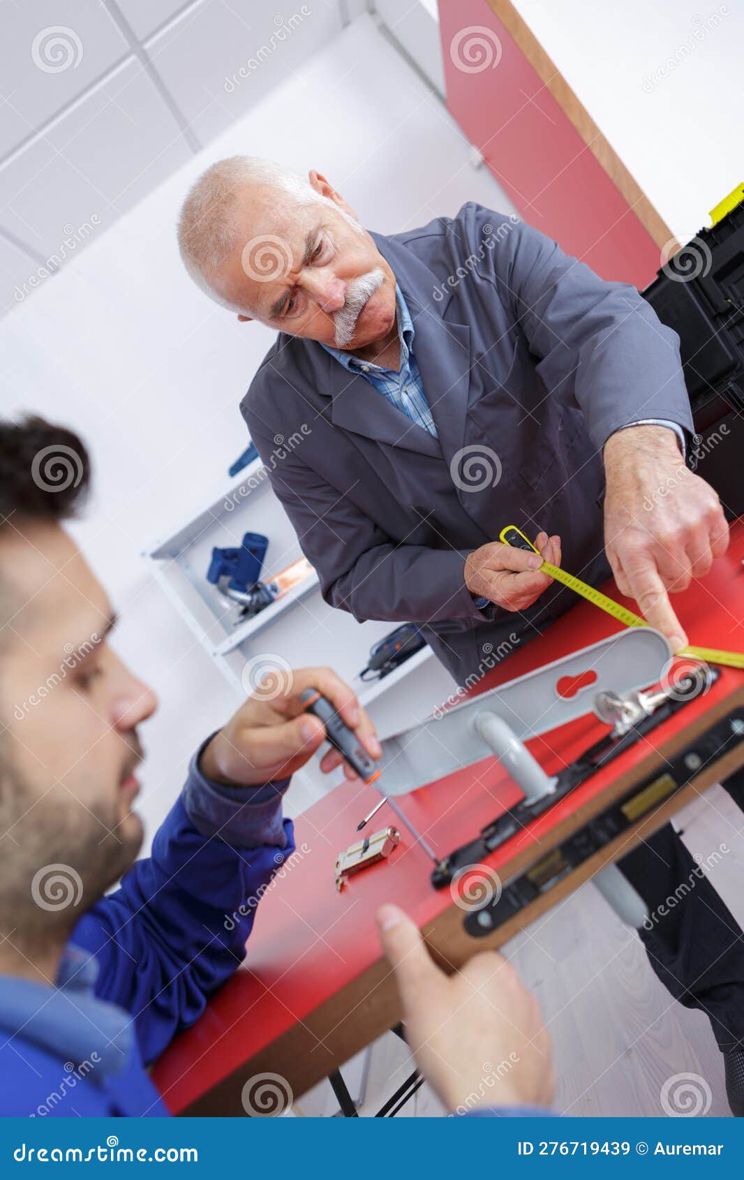 Men Fixing Locking Mechanism To Door Stock Image - Image of measure ...