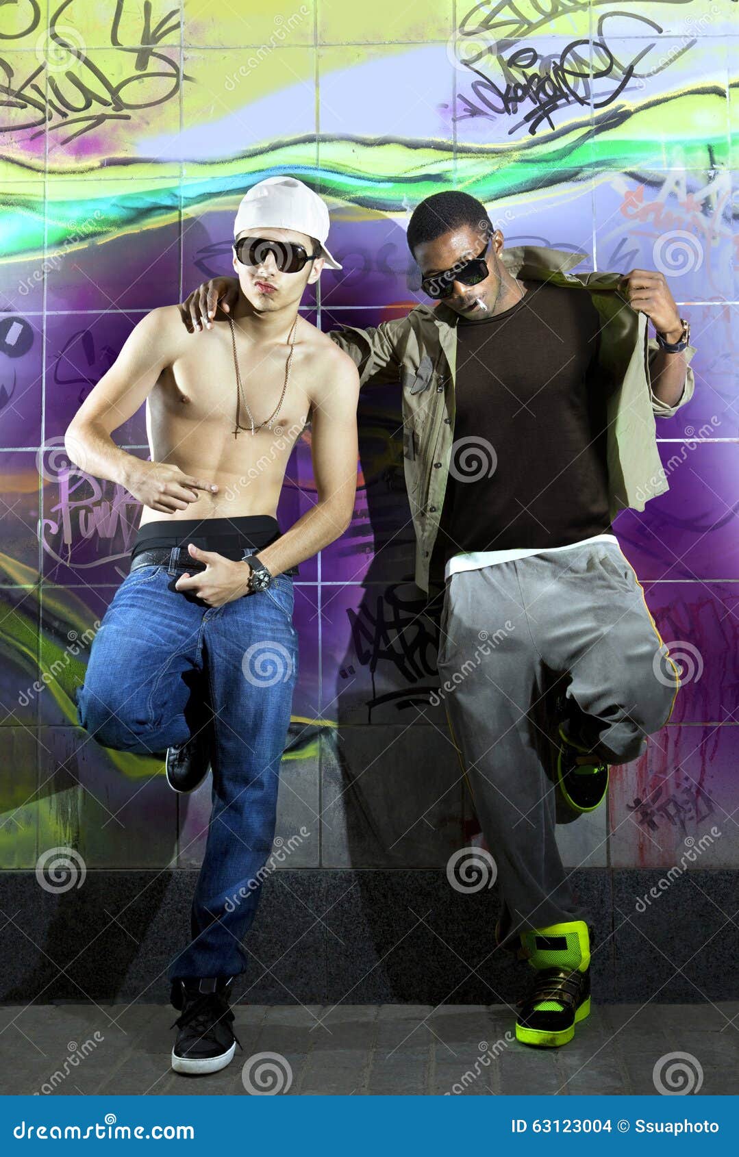 Men in front of wall stock photo. Image of blackamoor - 63123004