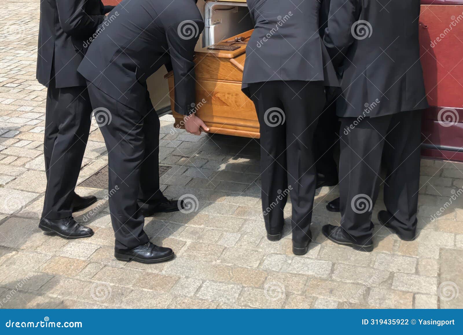 Men of Funeral Service Loading the Coffin into the Hearse Stock Photo ...