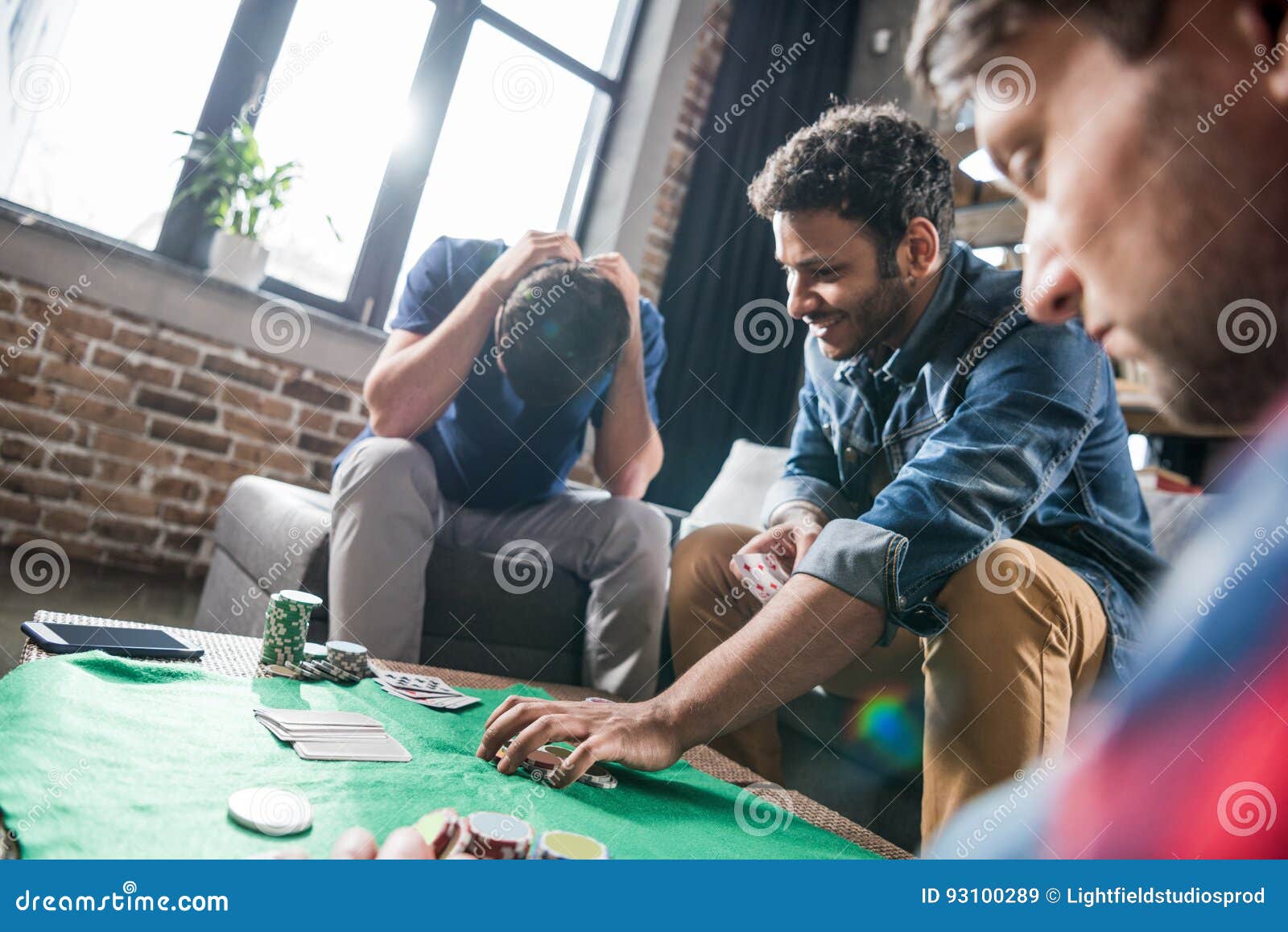 Men at gaming table stock image. Image of multiethnic - 93100289
