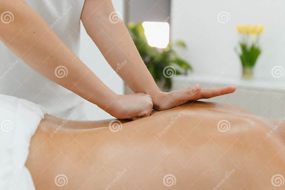 A Man Getting a Back Massage Lying Down at Spa Stock Photo - Image of ...
