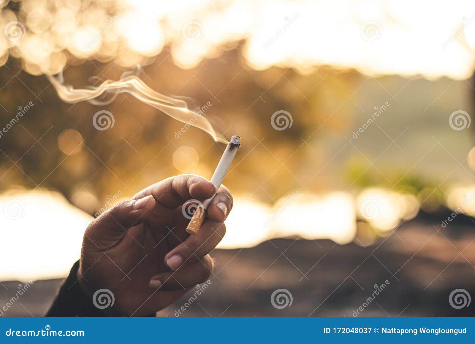 Men Hand Caught a Burning Cigarette Causing Smoke, Concept Stop Smoking ...