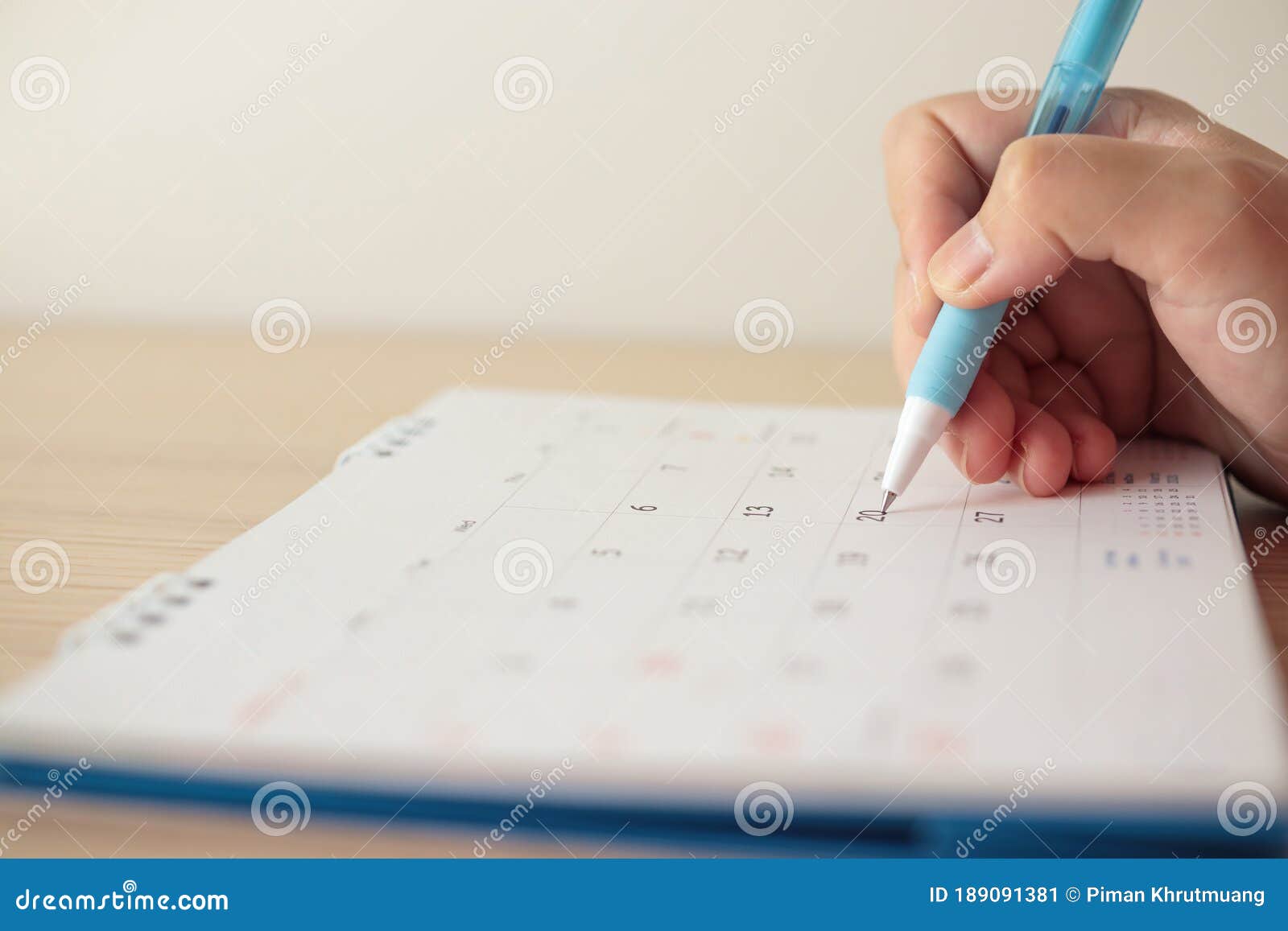 Hand with Pen Writing on Calendar Date Stock Image - Image of paper ...