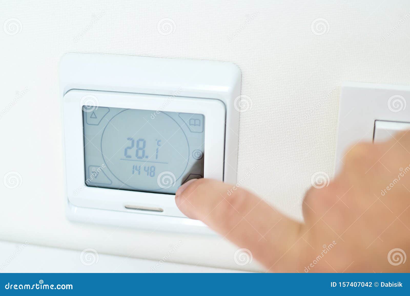 Men Hand Setting Temperature on the Underfloor Heating Control Panel ...