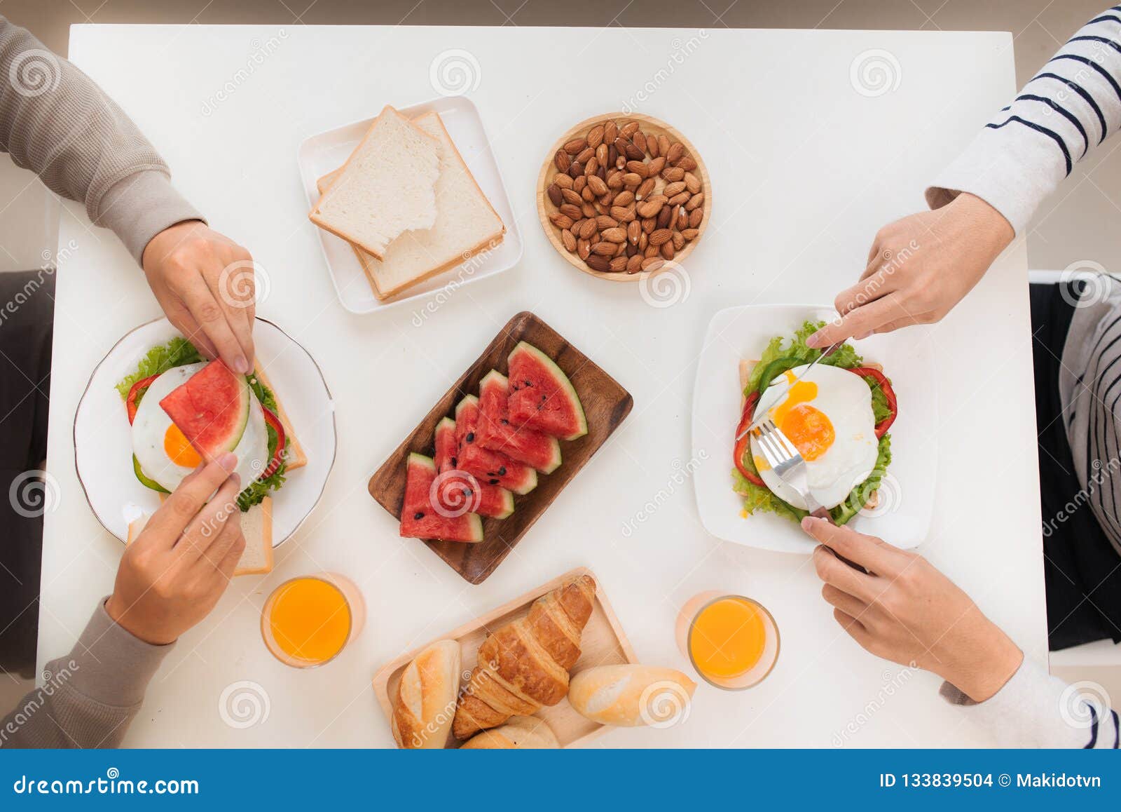 Men Having Breakfast with Toasts at Table Stock Photo - Image of ...
