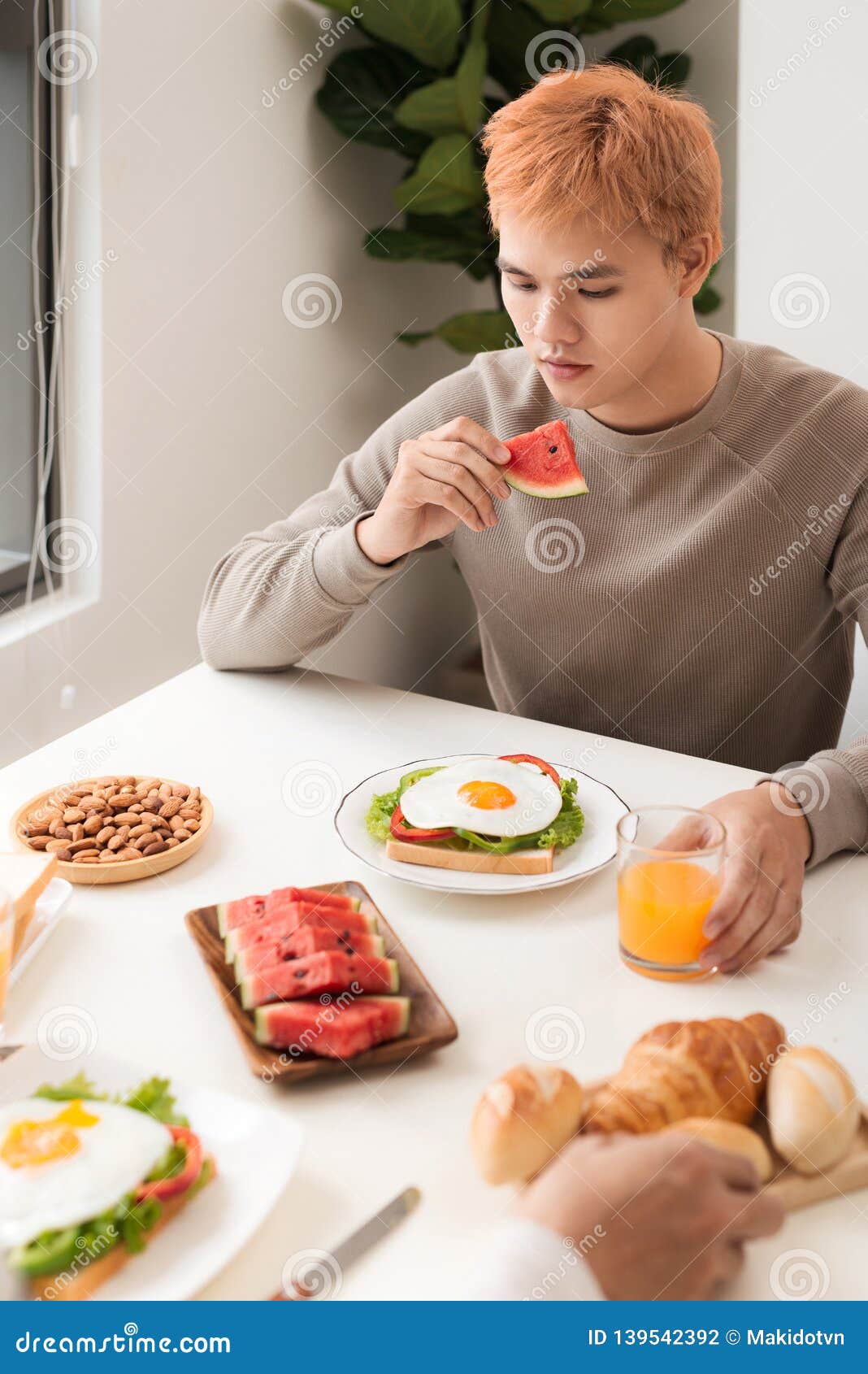 Men Having Breakfast with Toasts at Table Stock Photo - Image of ...