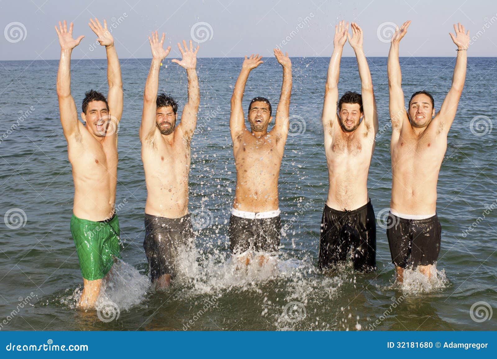 Men Having Fun on the Beach Stock Photo - Image of muscular ...