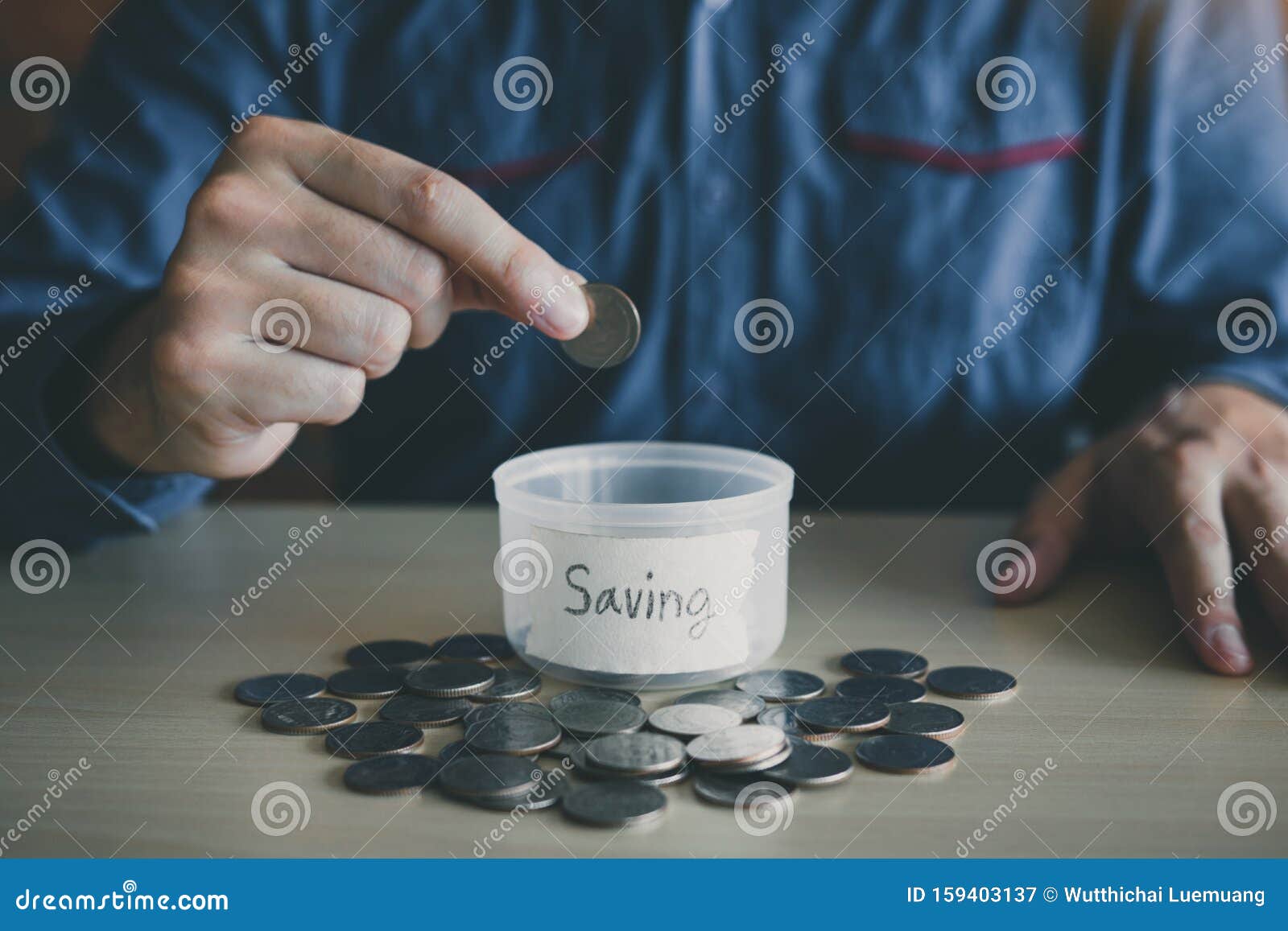 Men are Holding Coins Dropping To the Money Box with the Concept of ...