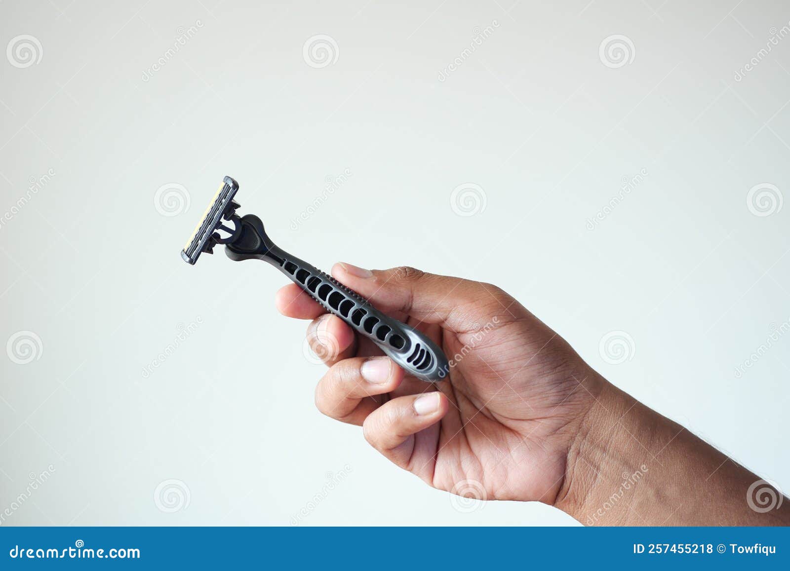 Men Holding a Razor Against White Wall Stock Photo - Image of equipment ...