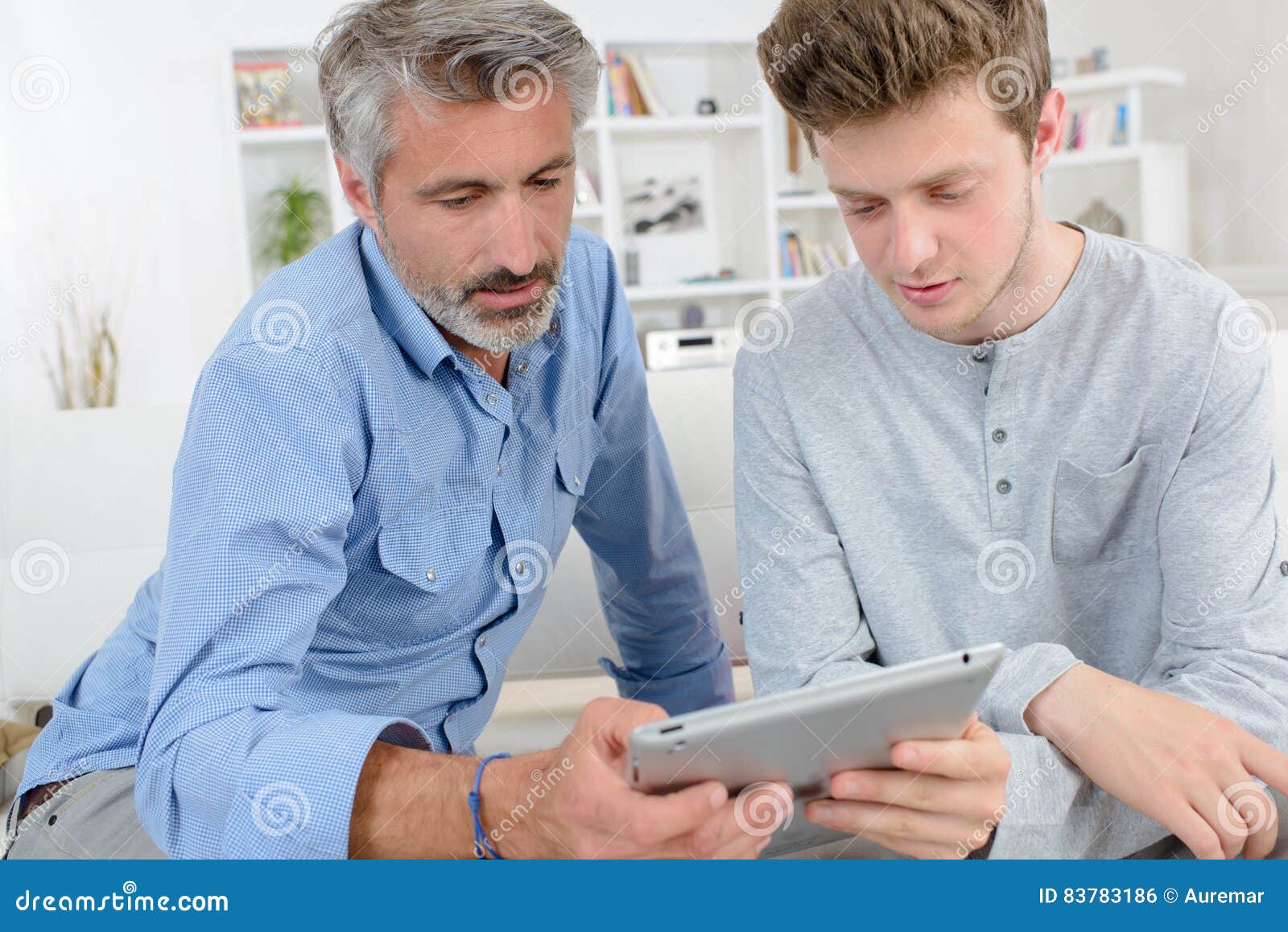 Men in house with tablet stock photo. Image of topic - 83783186