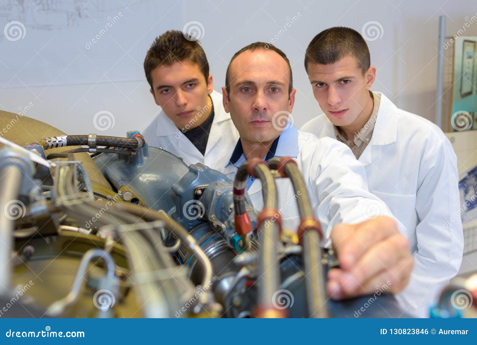 Men Inspecting Pipework on Machinery Stock Photo - Image of engineering ...