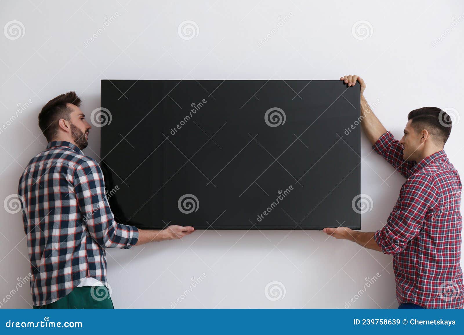 Men Installing Modern Flat Screen TV on Wall Indoors Stock Image ...