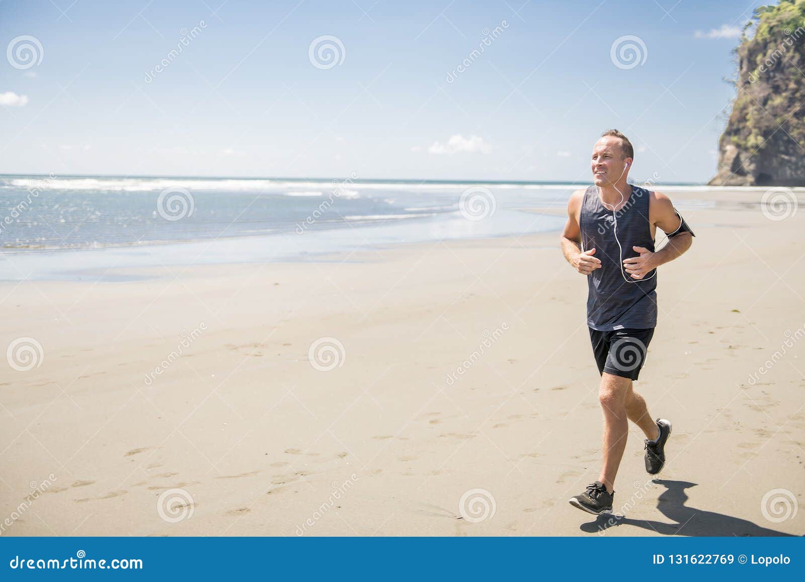 A Men Jogging on Day Time on the Beach Stock Image - Image of coast ...
