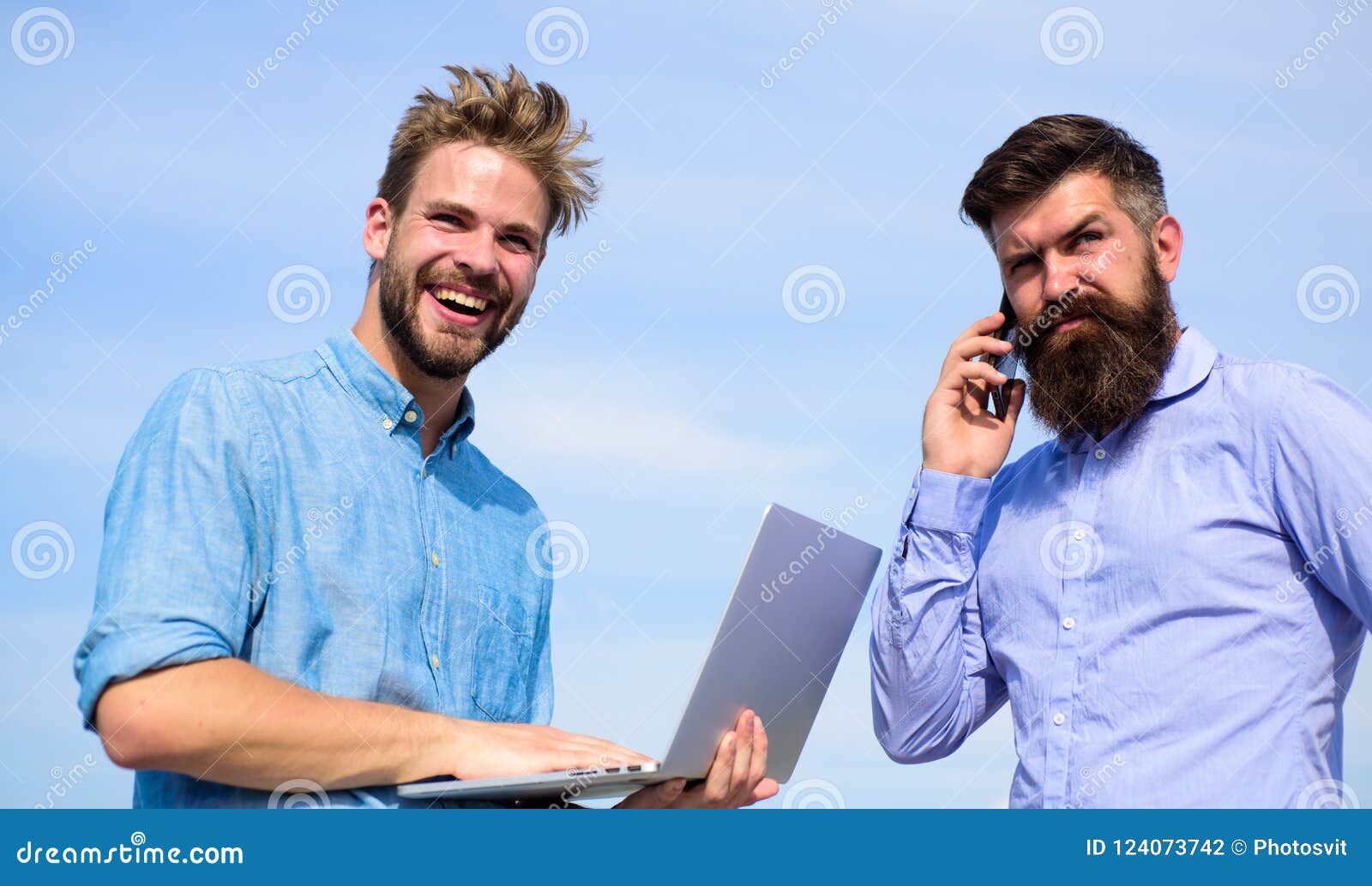 Men with Laptop and Smartphone Solving Problems Using Mobile Internet ...