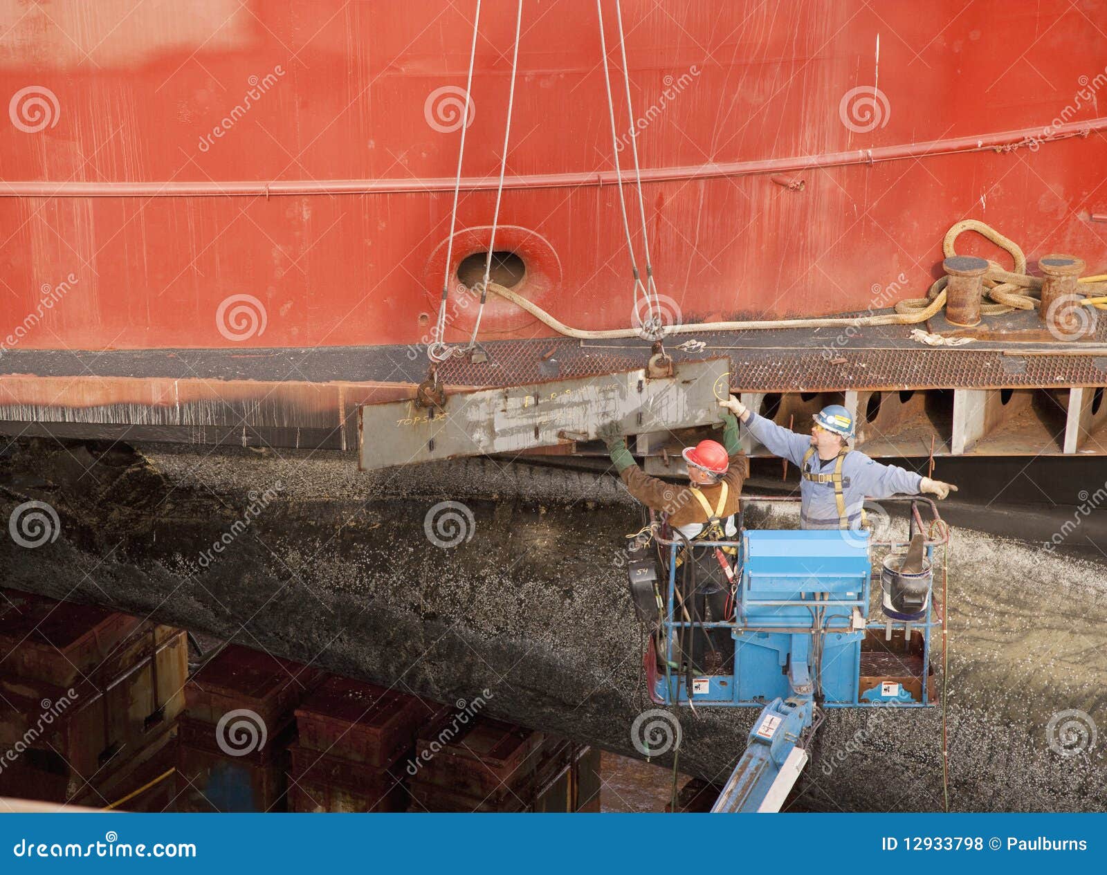 Men in Lift Guiding Steel Plate Stock Photo - Image of lowering, inside ...