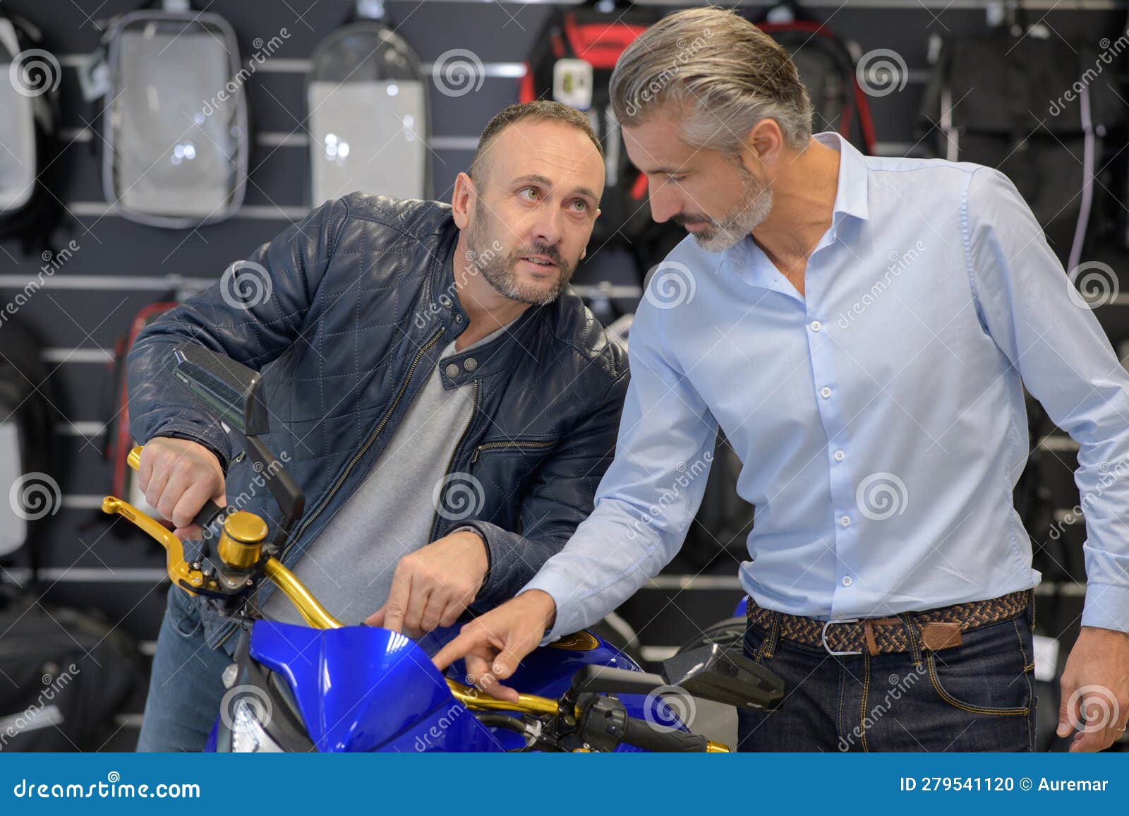 Men Looking at Motorcycle Speedometer Stock Photo - Image of kilometers ...