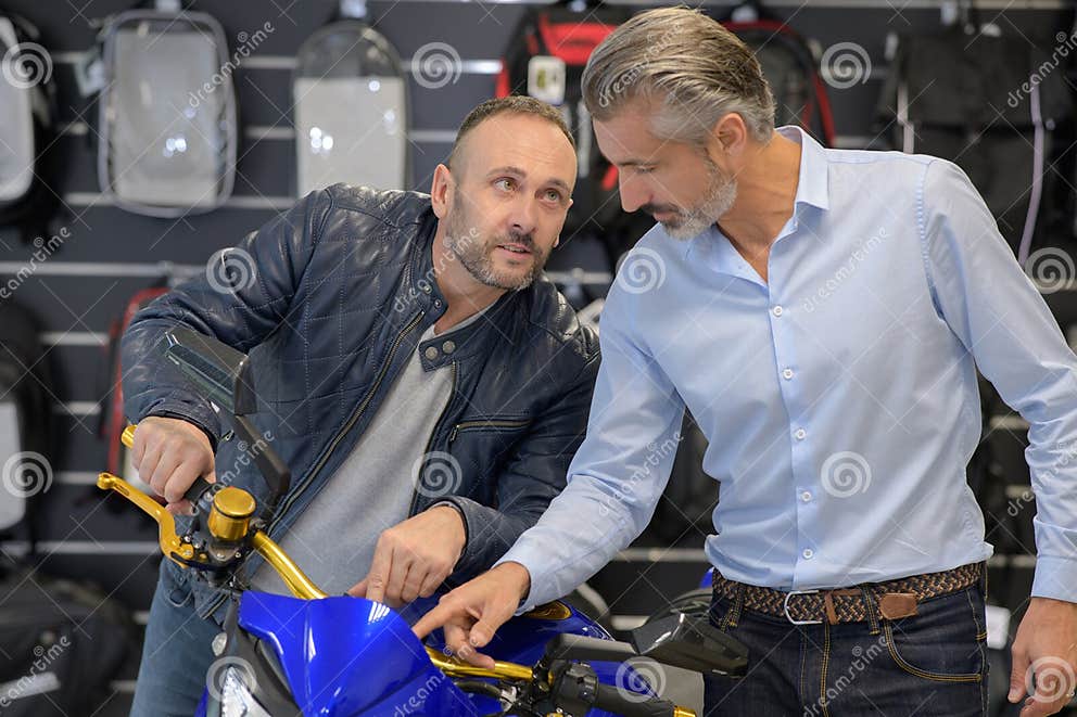 Men Looking at Motorcycle Speedometer Stock Photo - Image of kilometers ...