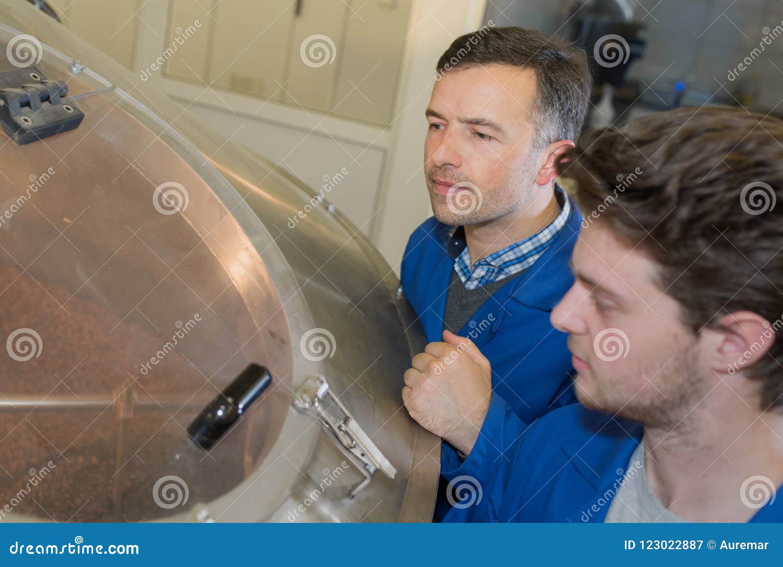 Men looking into vat stock image. Image of industrial - 123022887