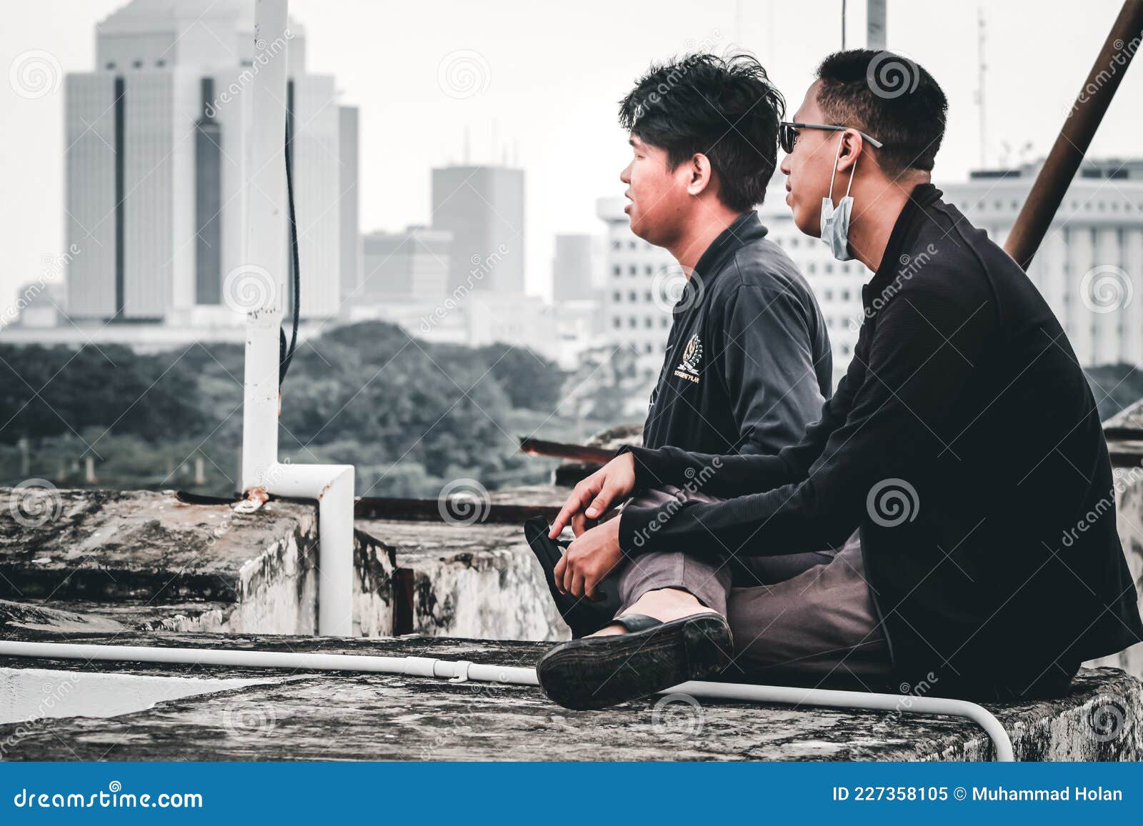 2 Men Looking at the View of the City of Jakarta on Top of the Building ...