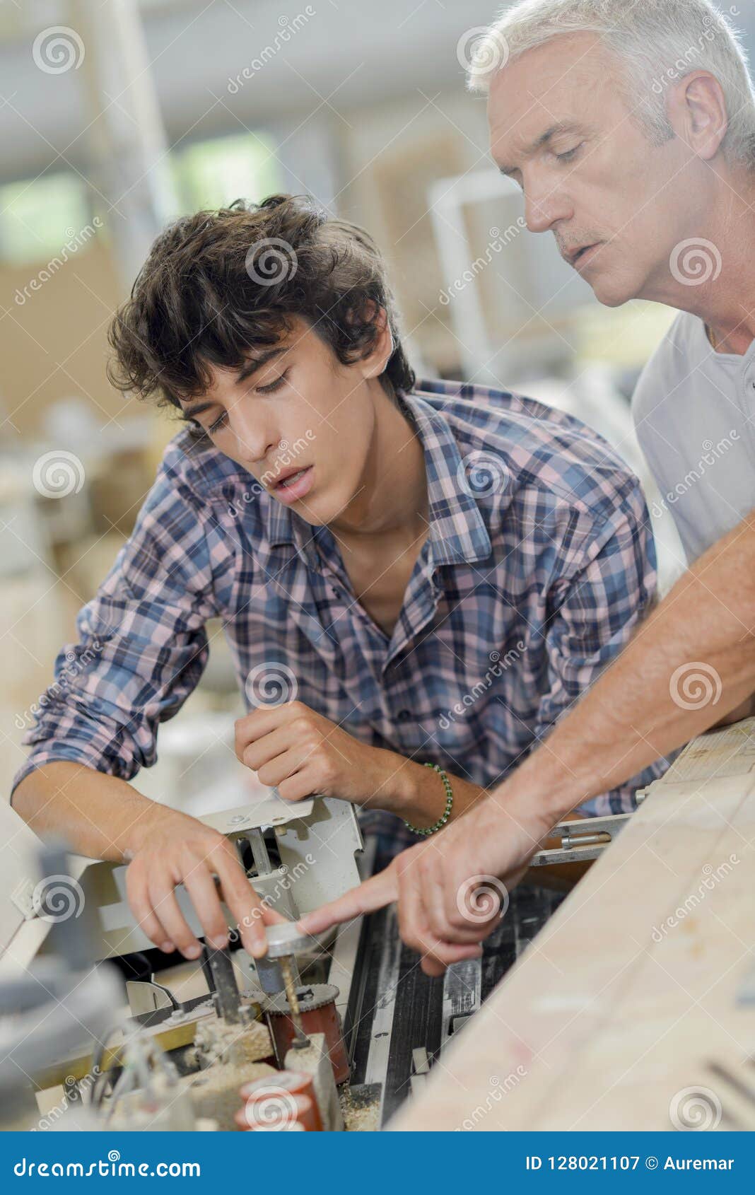 Men on a machine stock image. Image of school, carpentry - 128021107