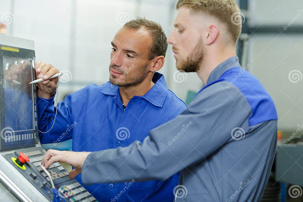 Men and machine operation stock image. Image of characteristic - 322654197