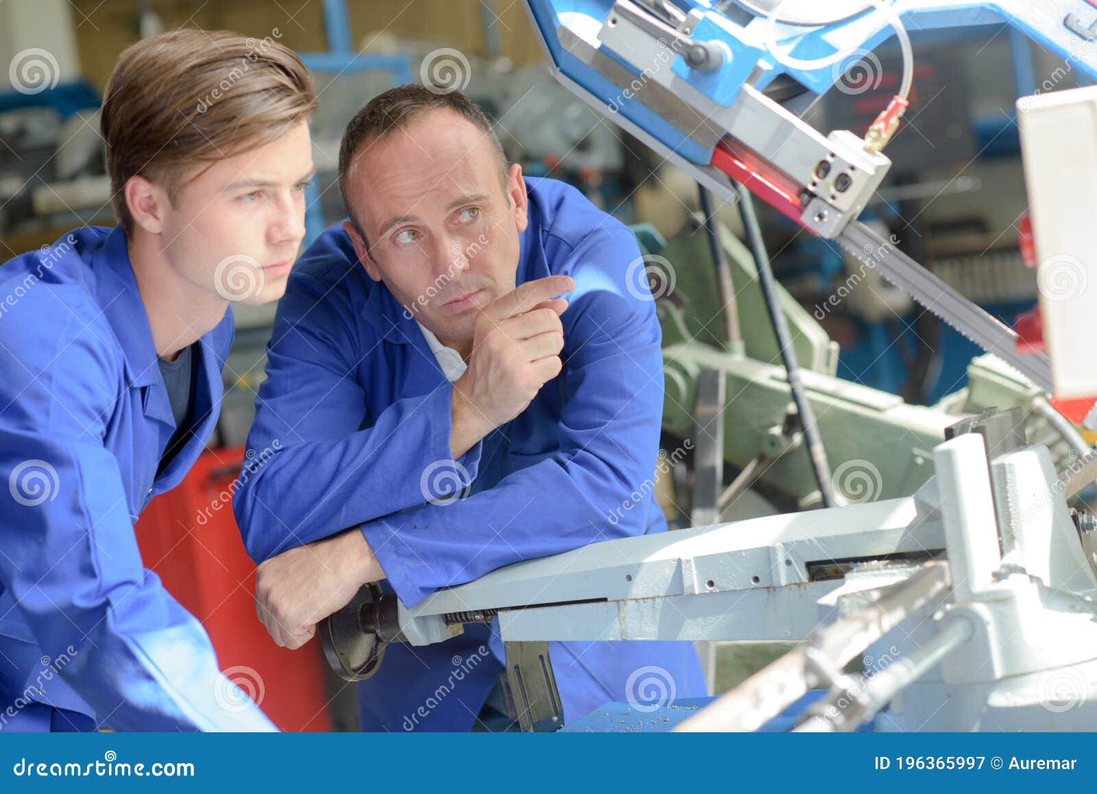 2 men and machine workers stock image. Image of modification - 196365997